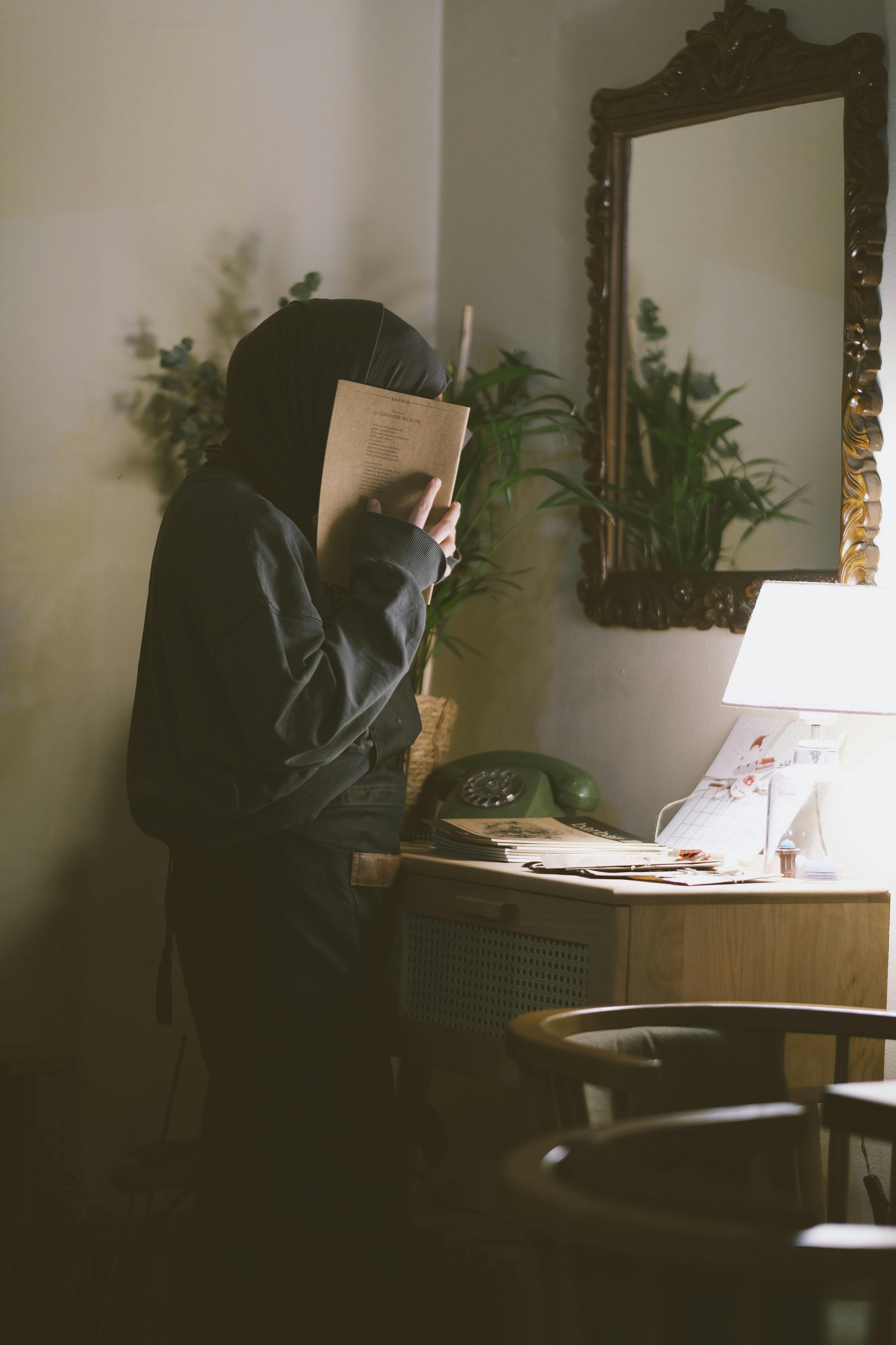 Student Holding Book Facing Backward Photos, Download The BEST Free ...