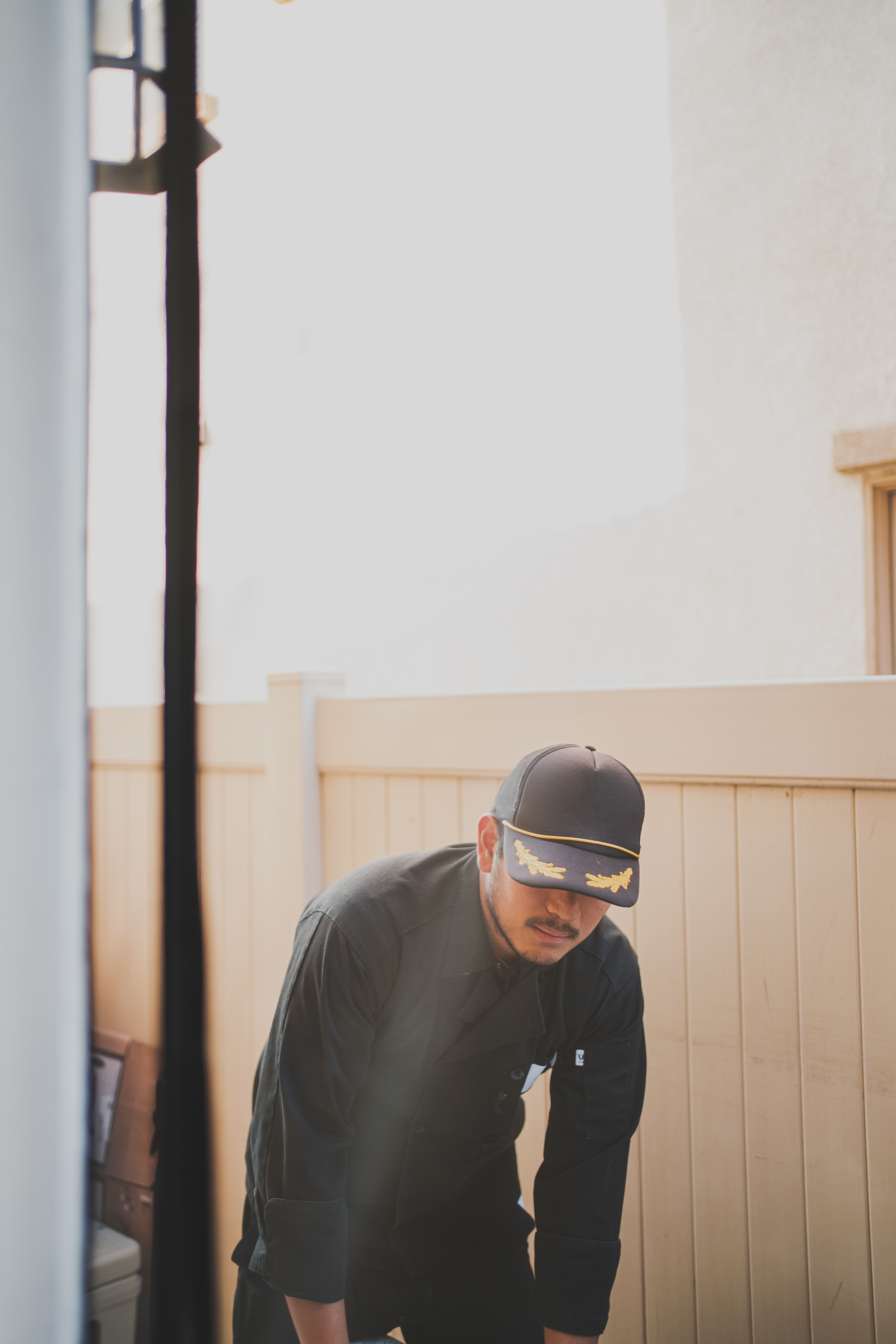 Man Wearing a Black Coverall and Cap · Free Stock Photo