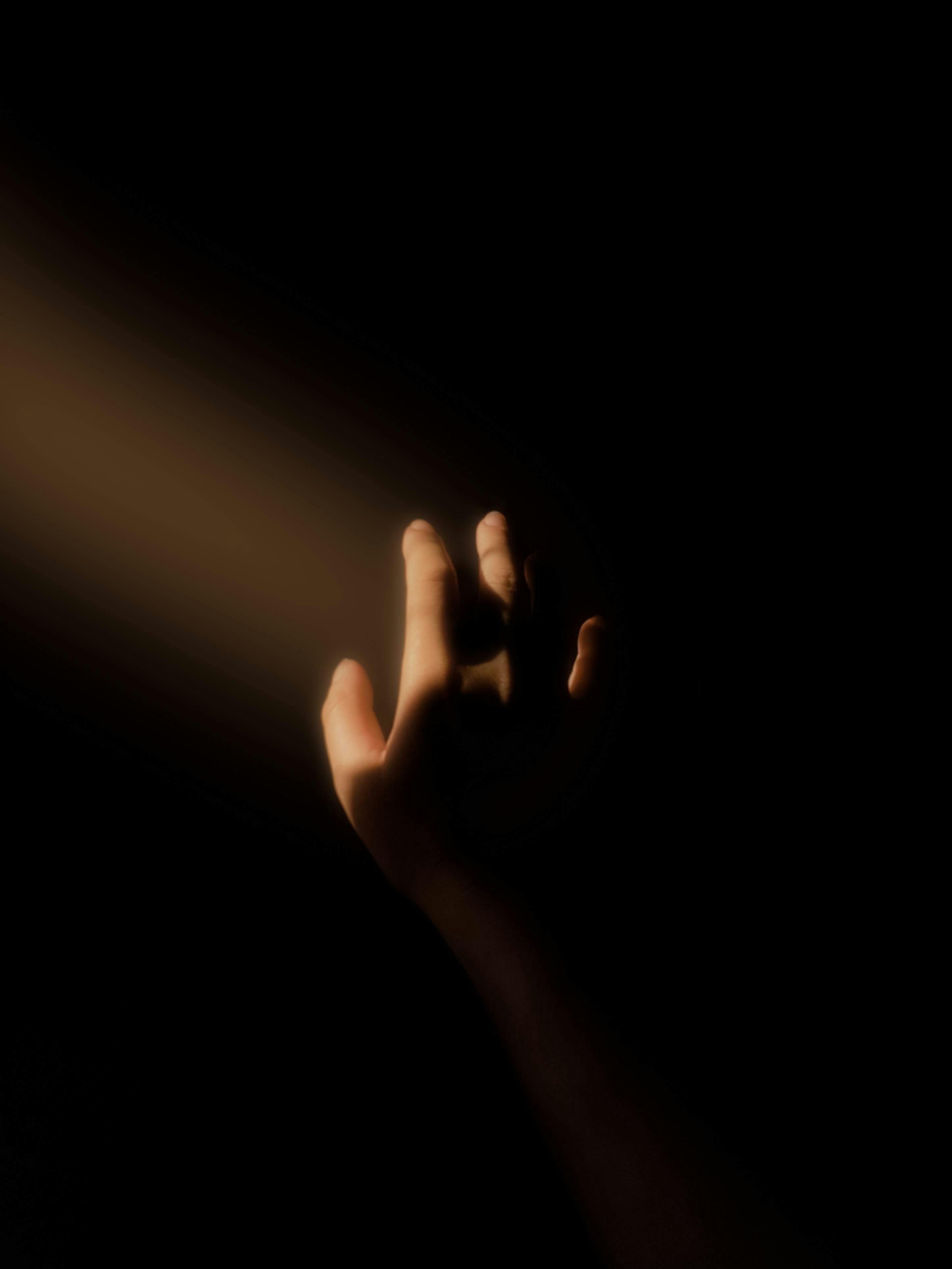 Hand in the Dark Room · Free Stock Photo