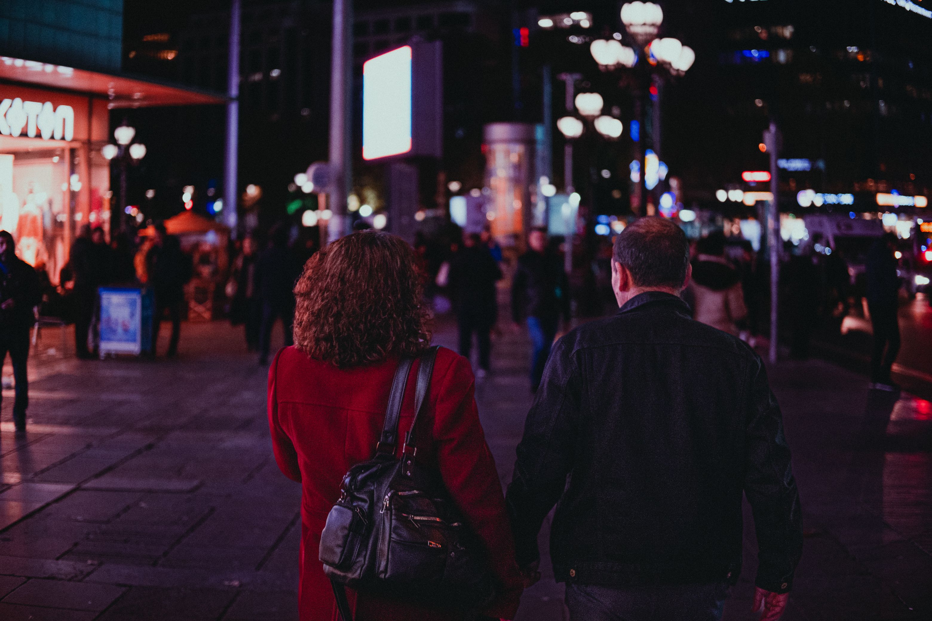 Back View of a Couple Holding Hands with Walking · Free Stock Photo