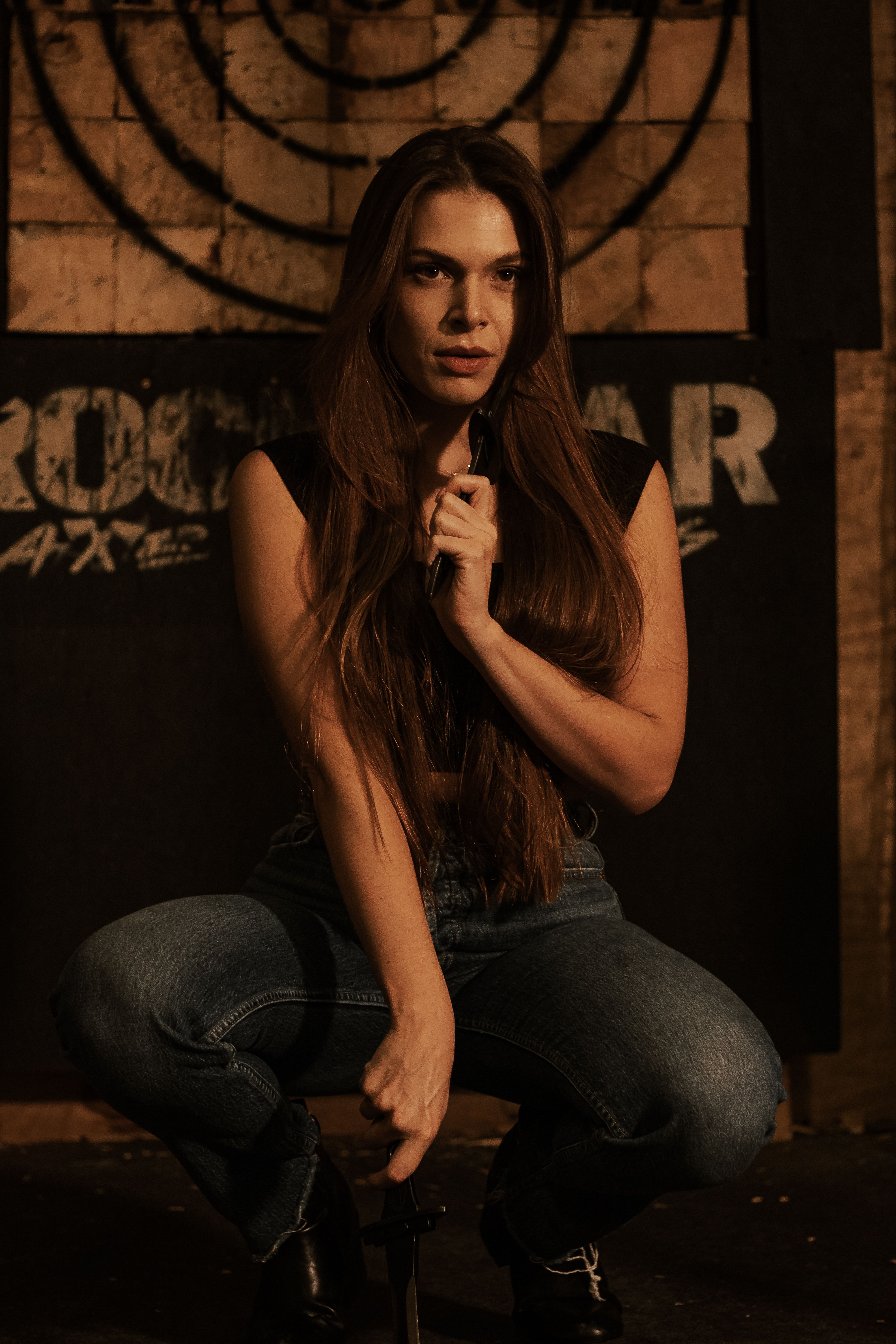 Young Woman Holding Knives behind Her Back · Free Stock Photo