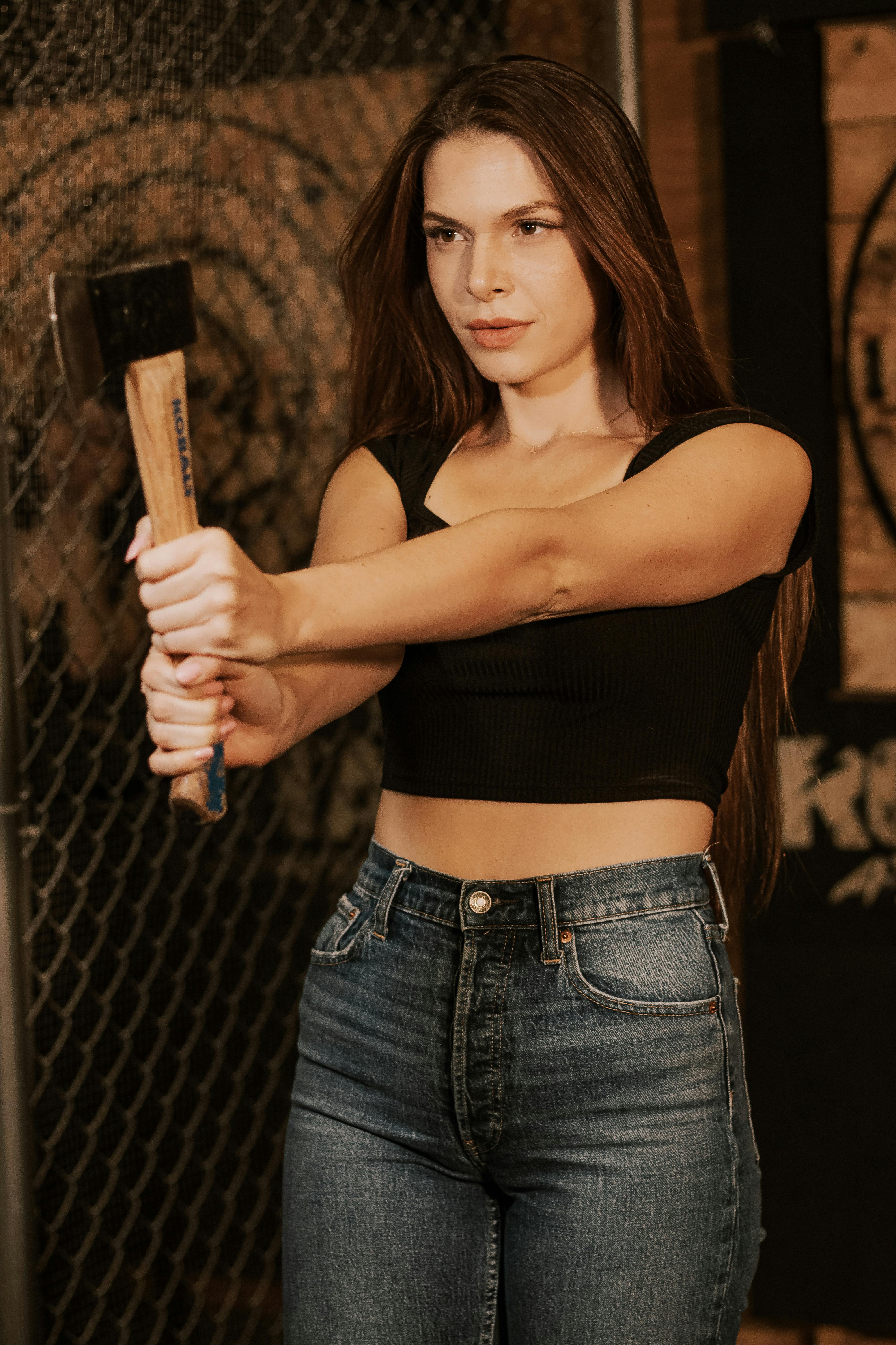 Beautiful Woman Holding an Axe · Free Stock Photo