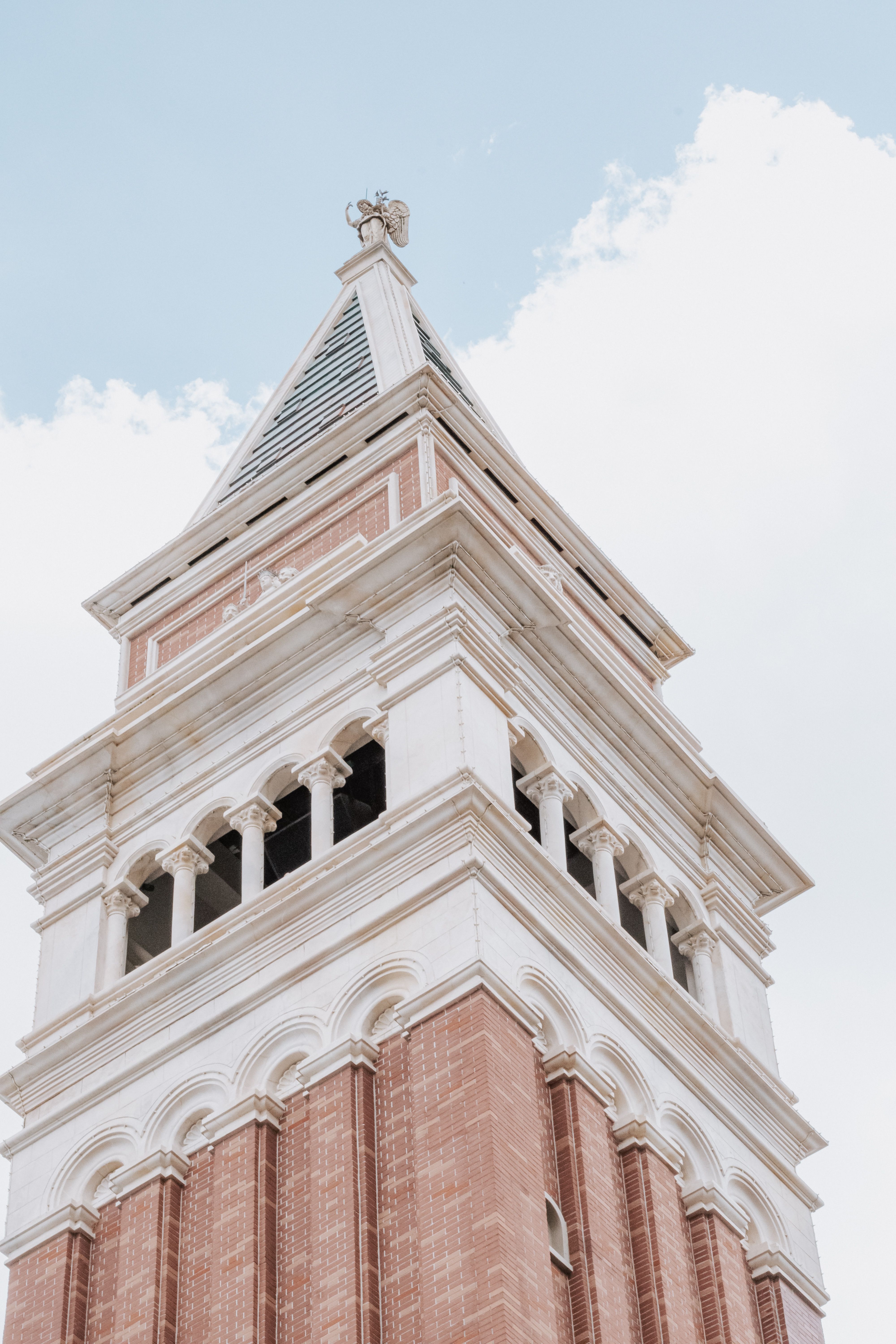 Neoclassical Tower against Fluffy White Cloud · Free Stock Photo