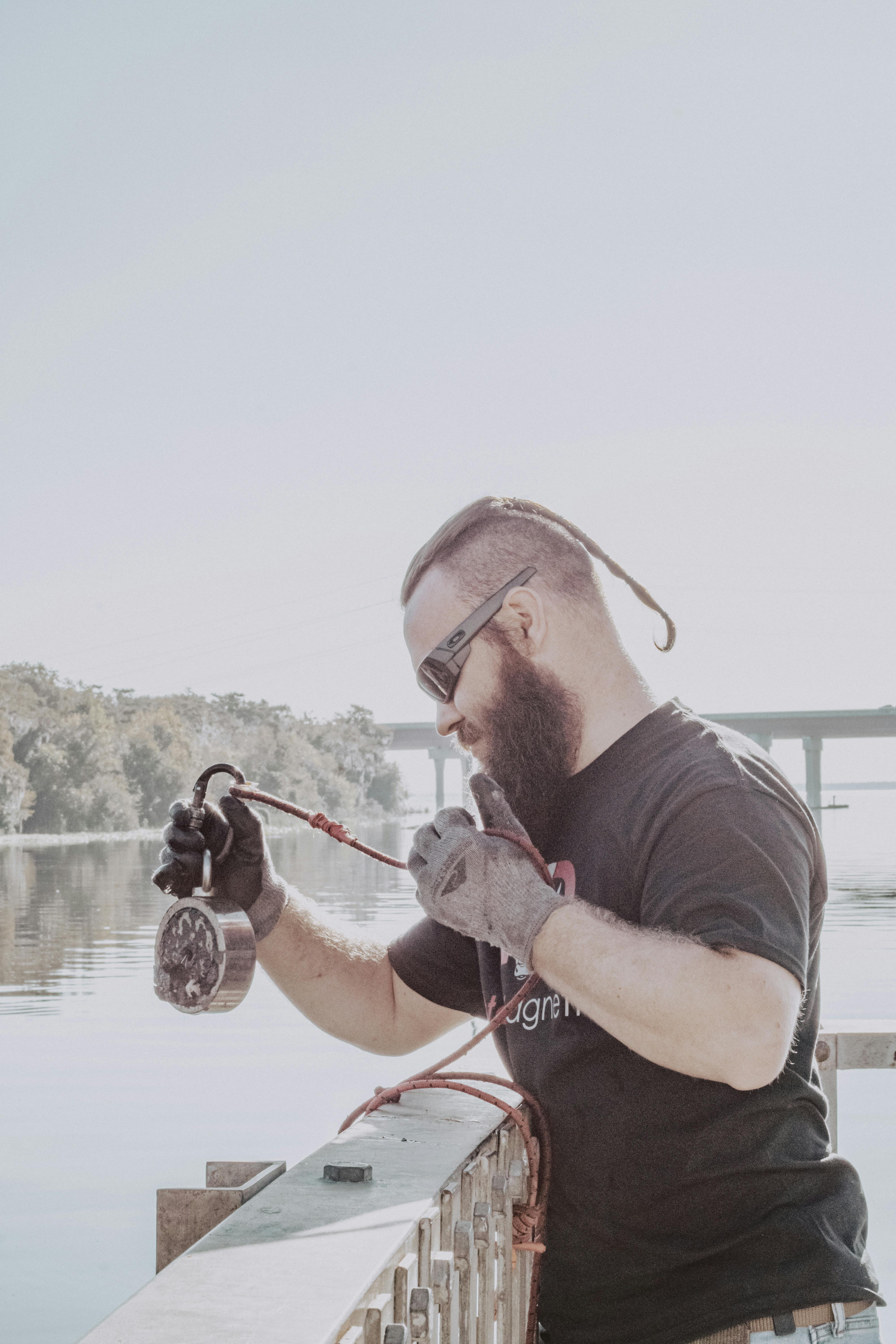 Man with Rope by River · Free Stock Photo