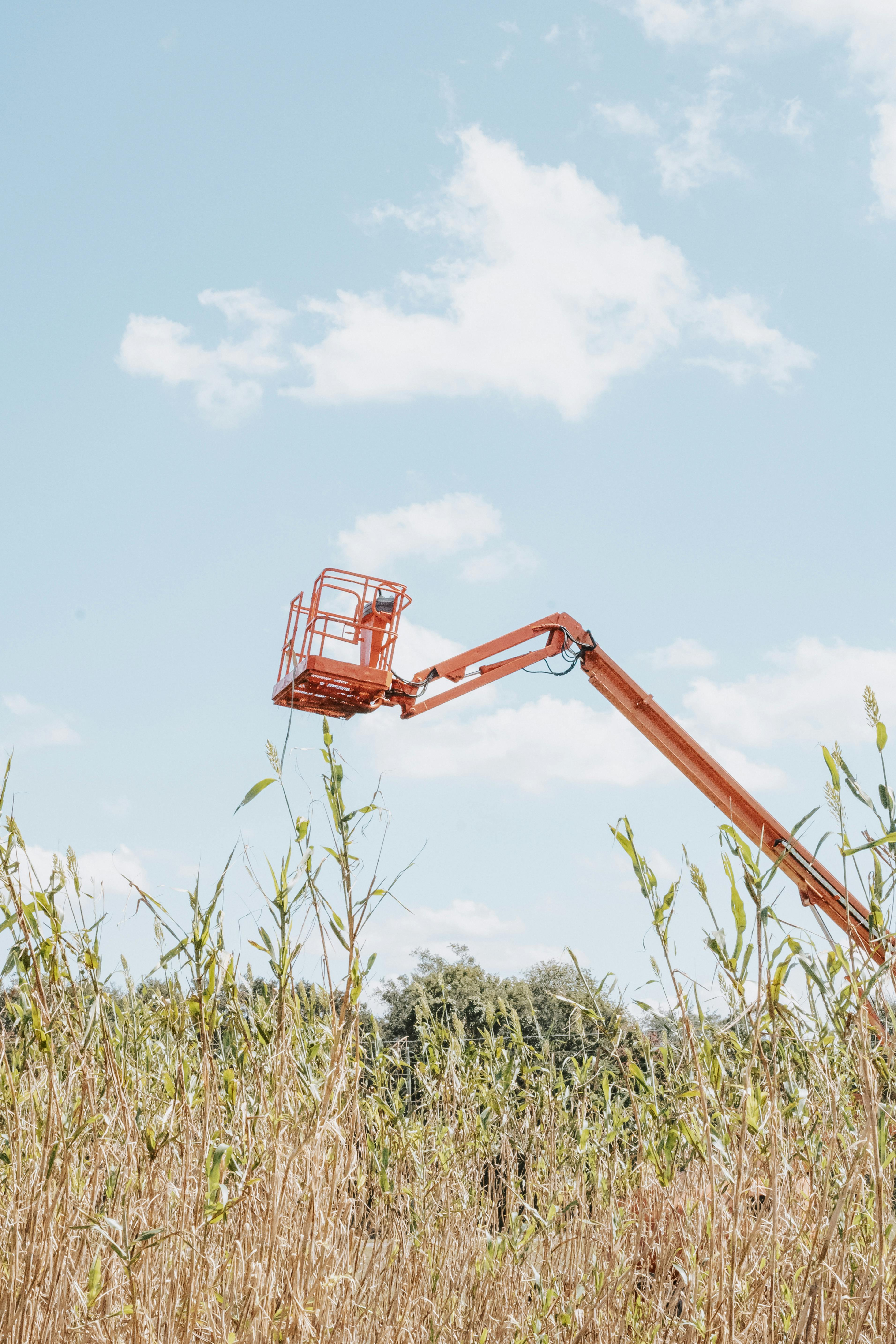 Tractor Working in Grassland in Countryside · Free Stock Photo
