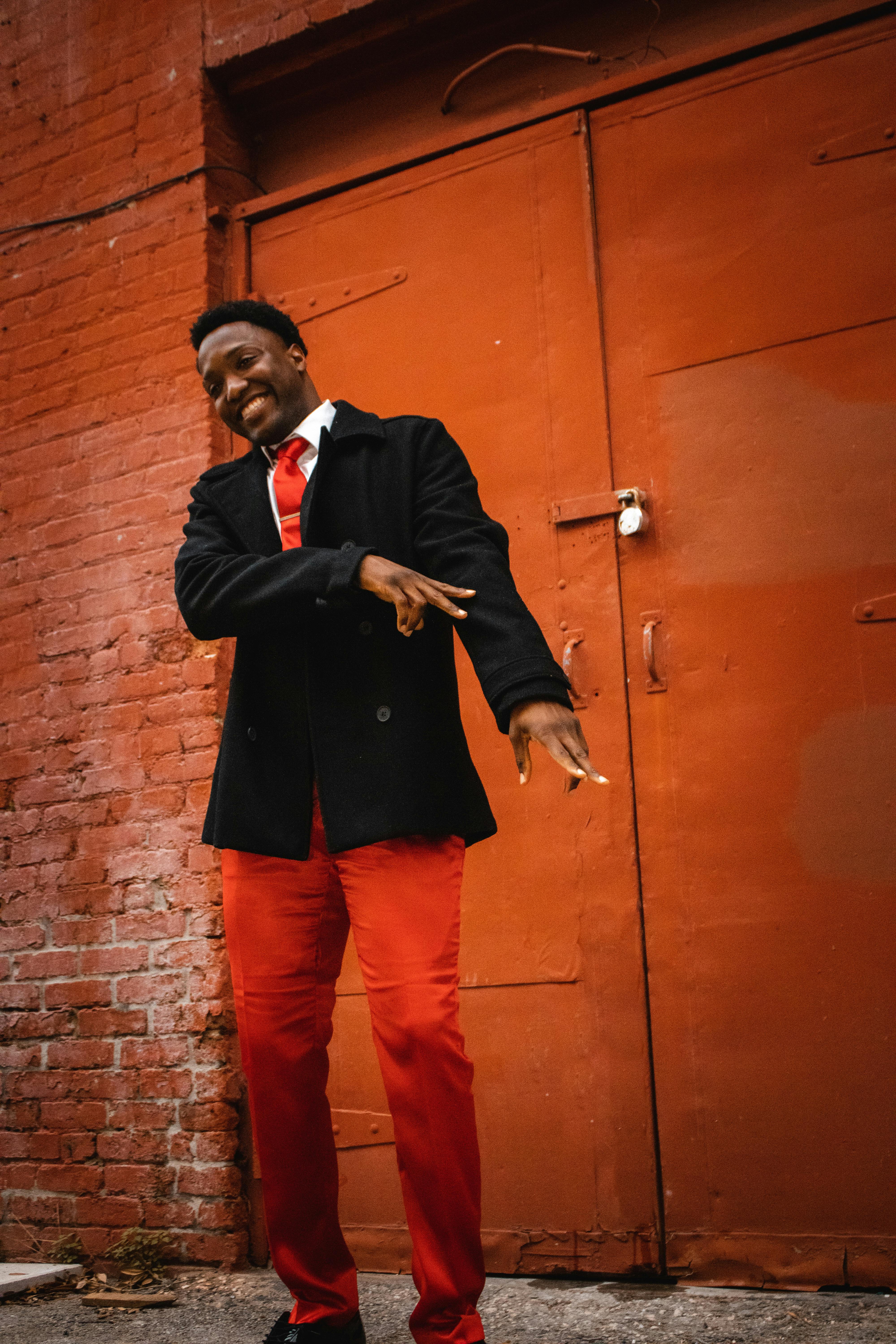 Man in Suit Posing near Locked Door · Free Stock Photo