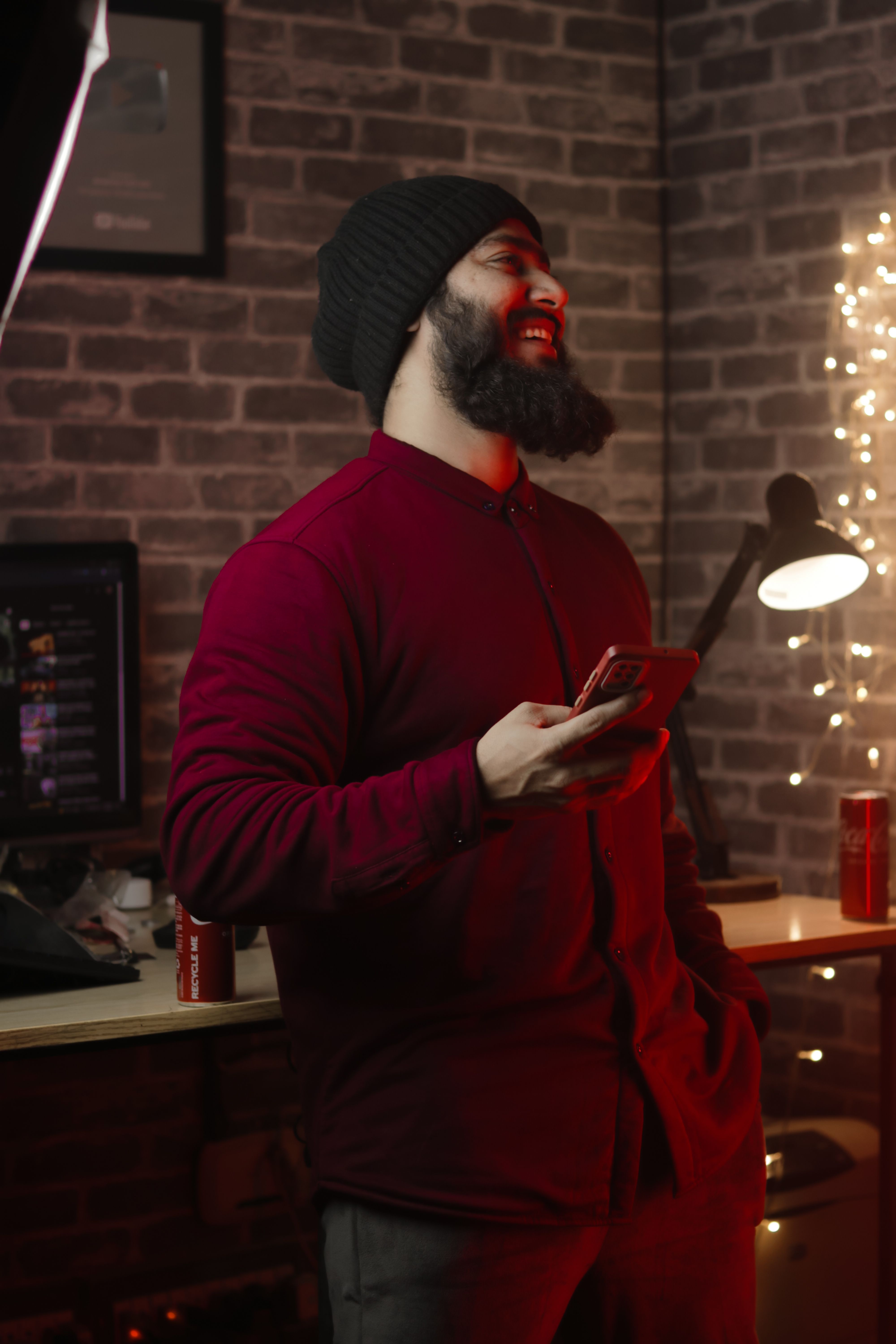 Man in Hat and Beard Standing by Table · Free Stock Photo