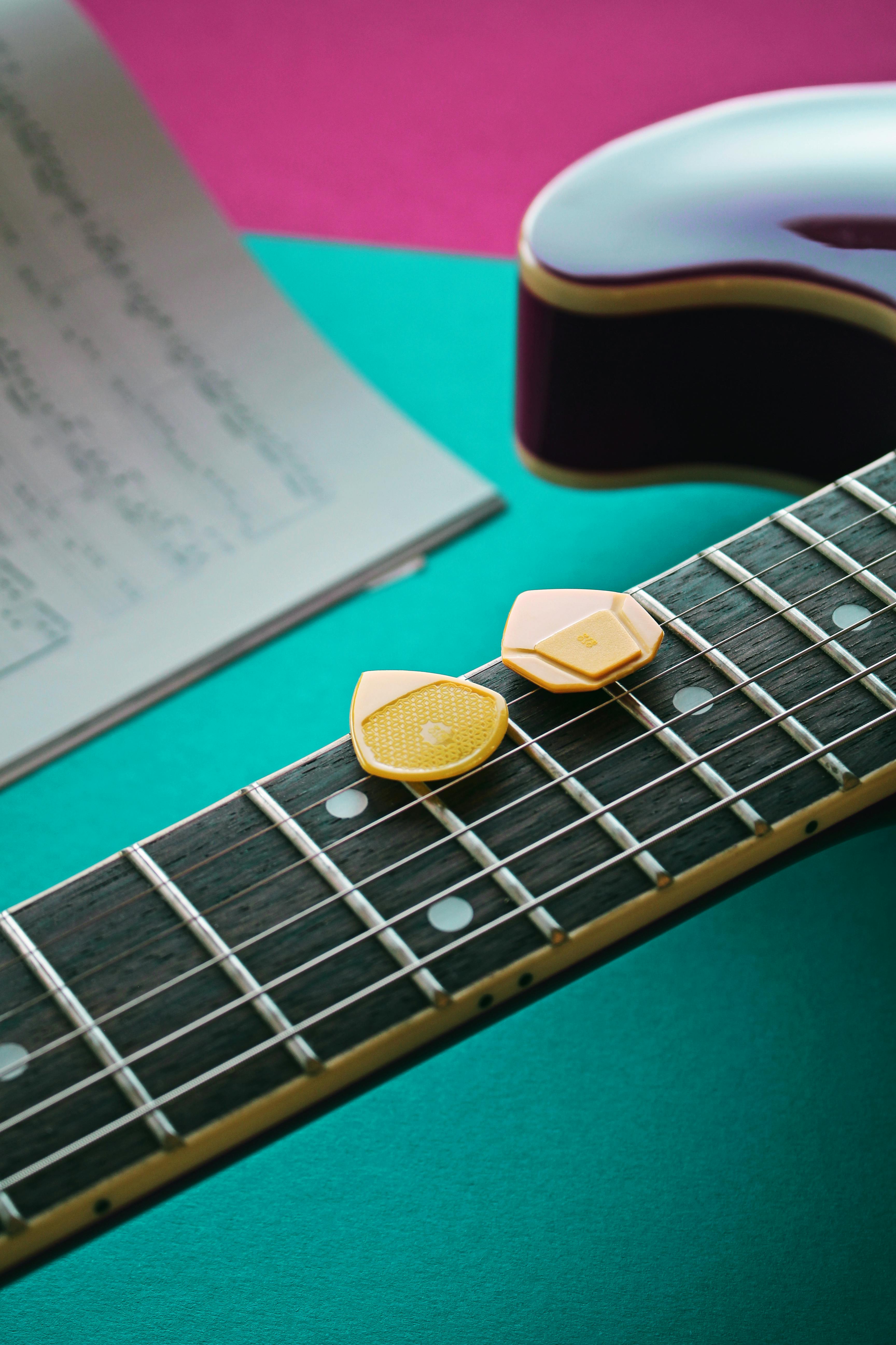 Yellow Guitar Picks in Close Up Photography · Free Stock Photo