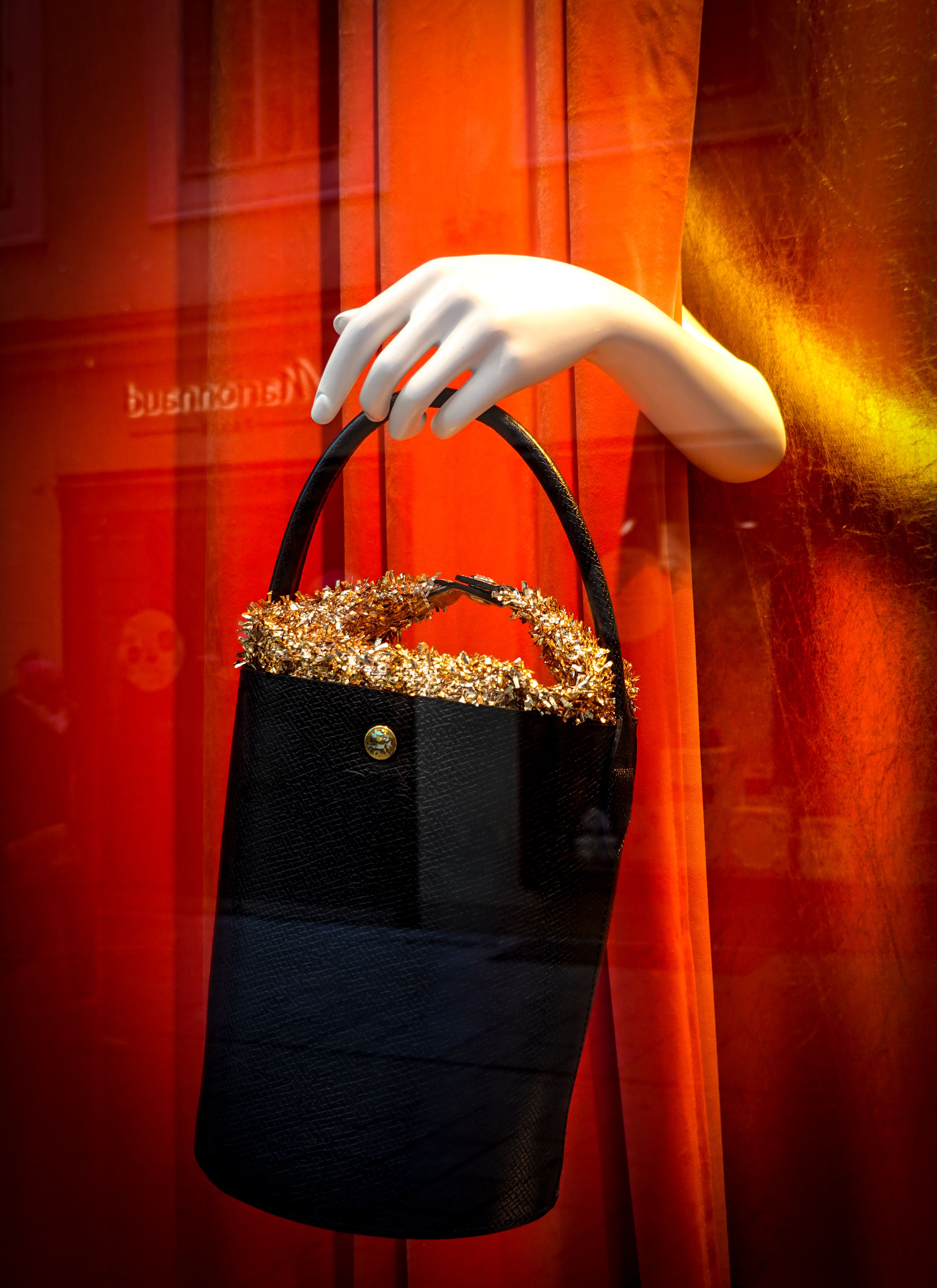 Mannequin Hand Holding Black Bucket · Free Stock Photo