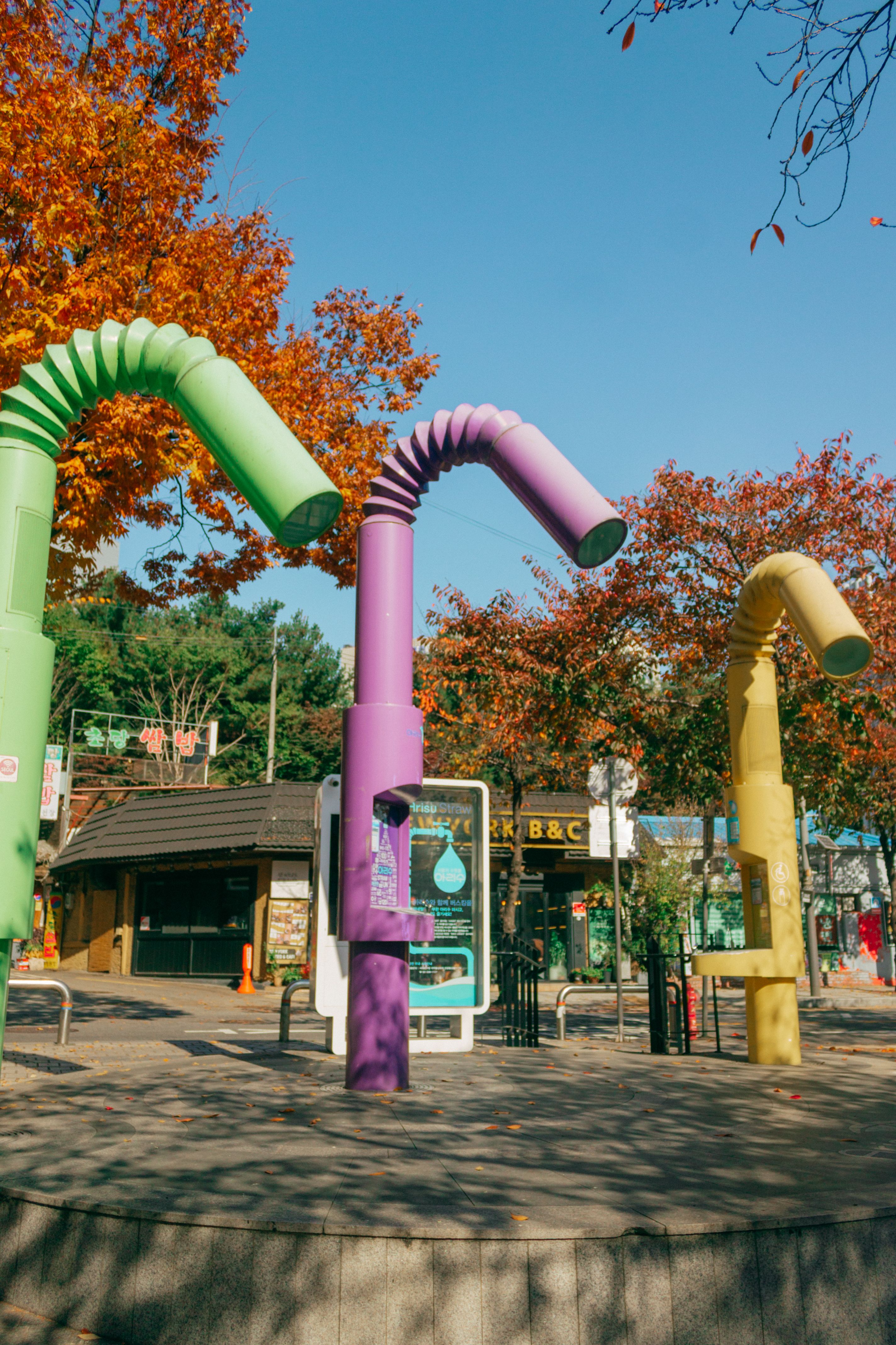 Colorful Straw Shaped Payphones · Free Stock Photo
