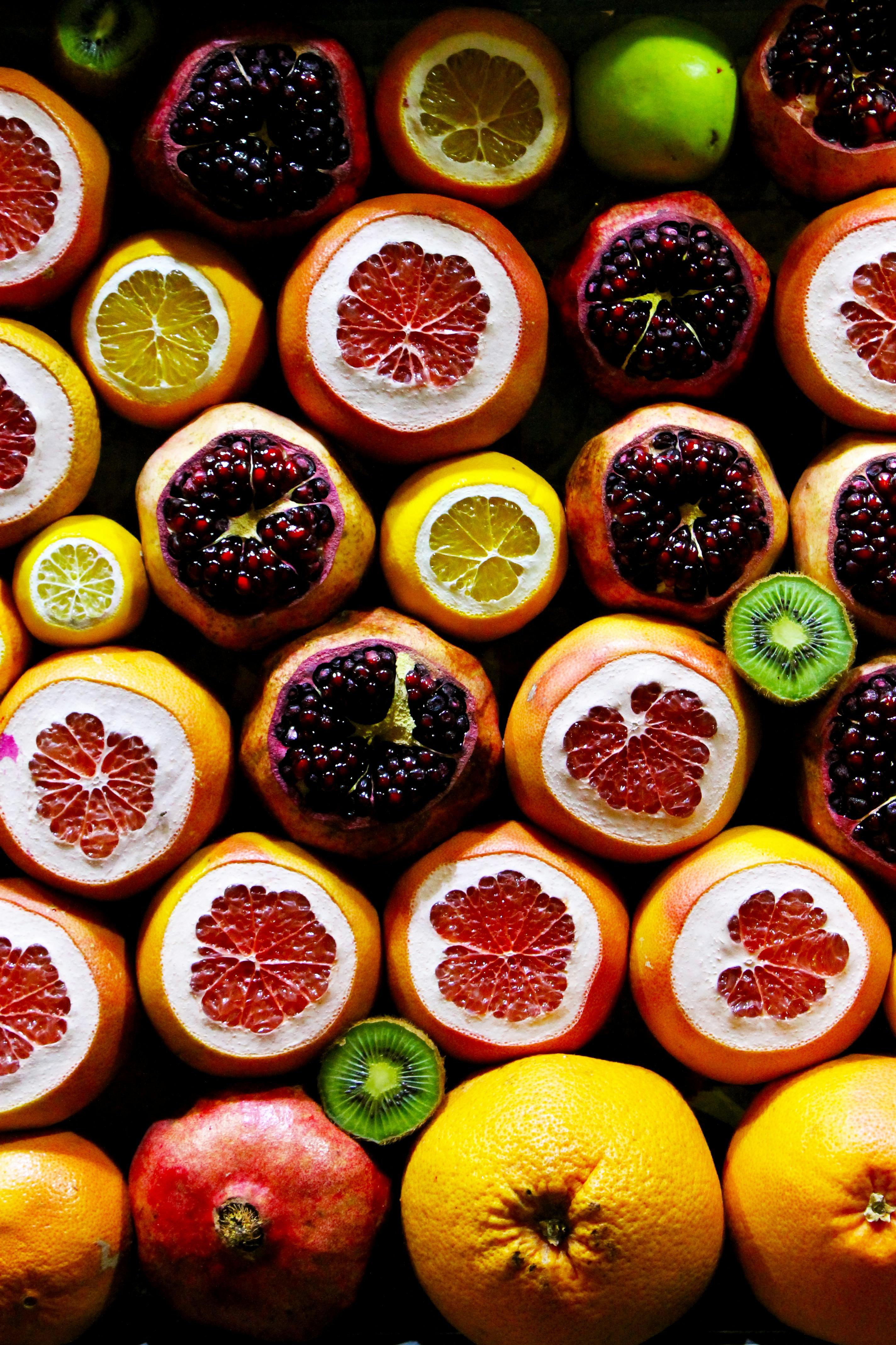 Full Shot of Citrus Fruits Cut Open · Free Stock Photo