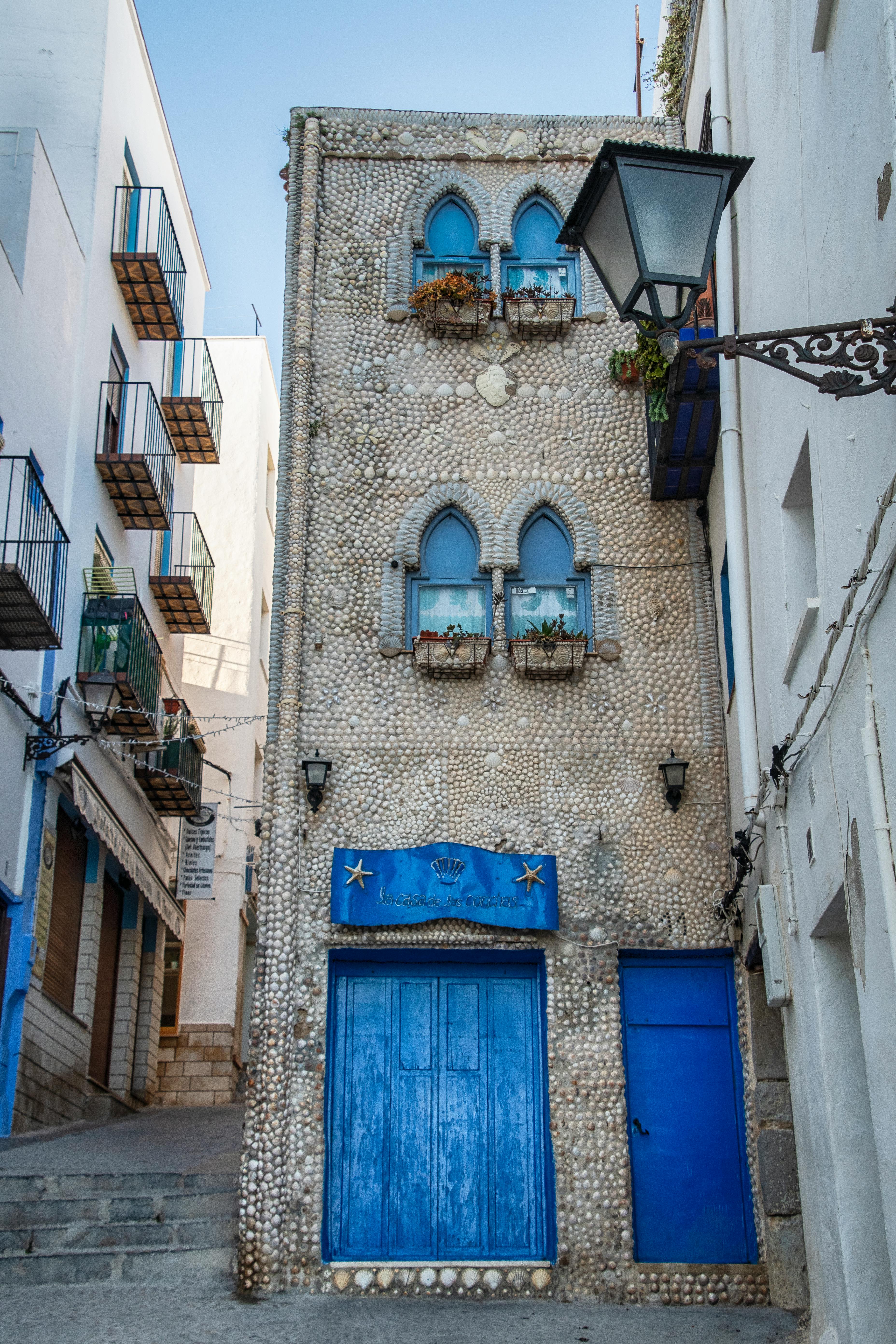 Ornamented Building in Town Alley · Free Stock Photo