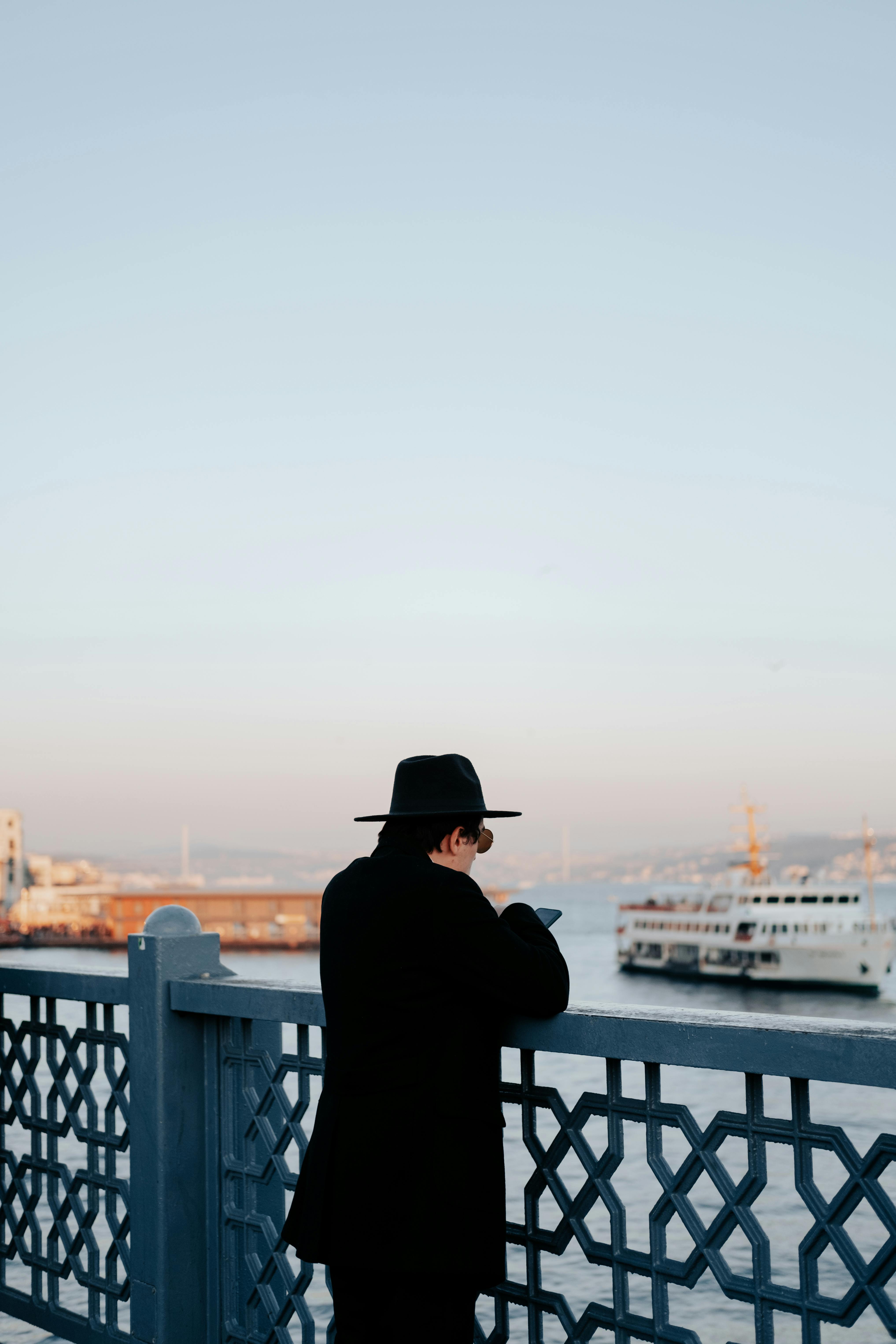 Man Standing by the Railing · Free Stock Photo