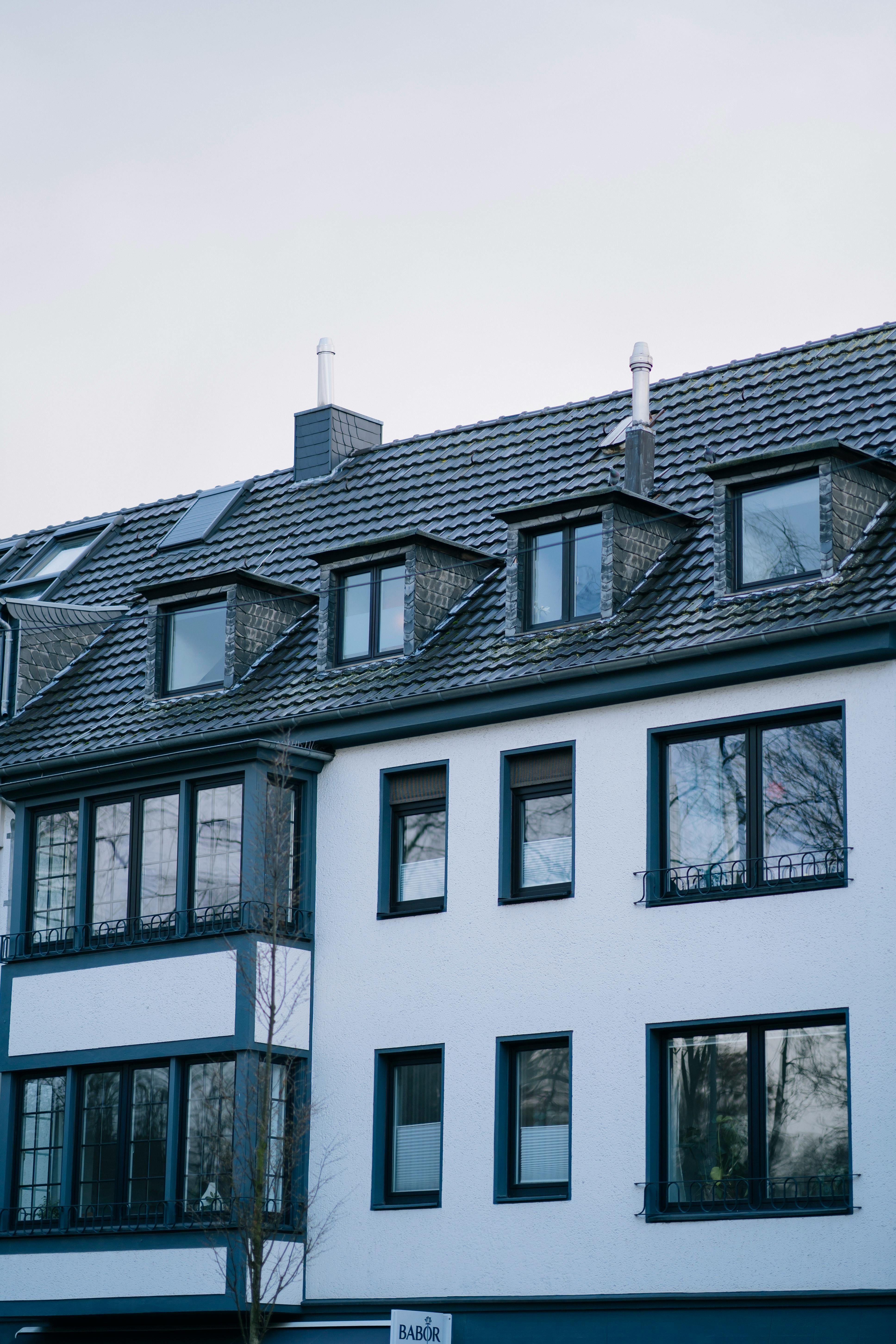 Reflections in Windows of Residential Building · Free Stock Photo