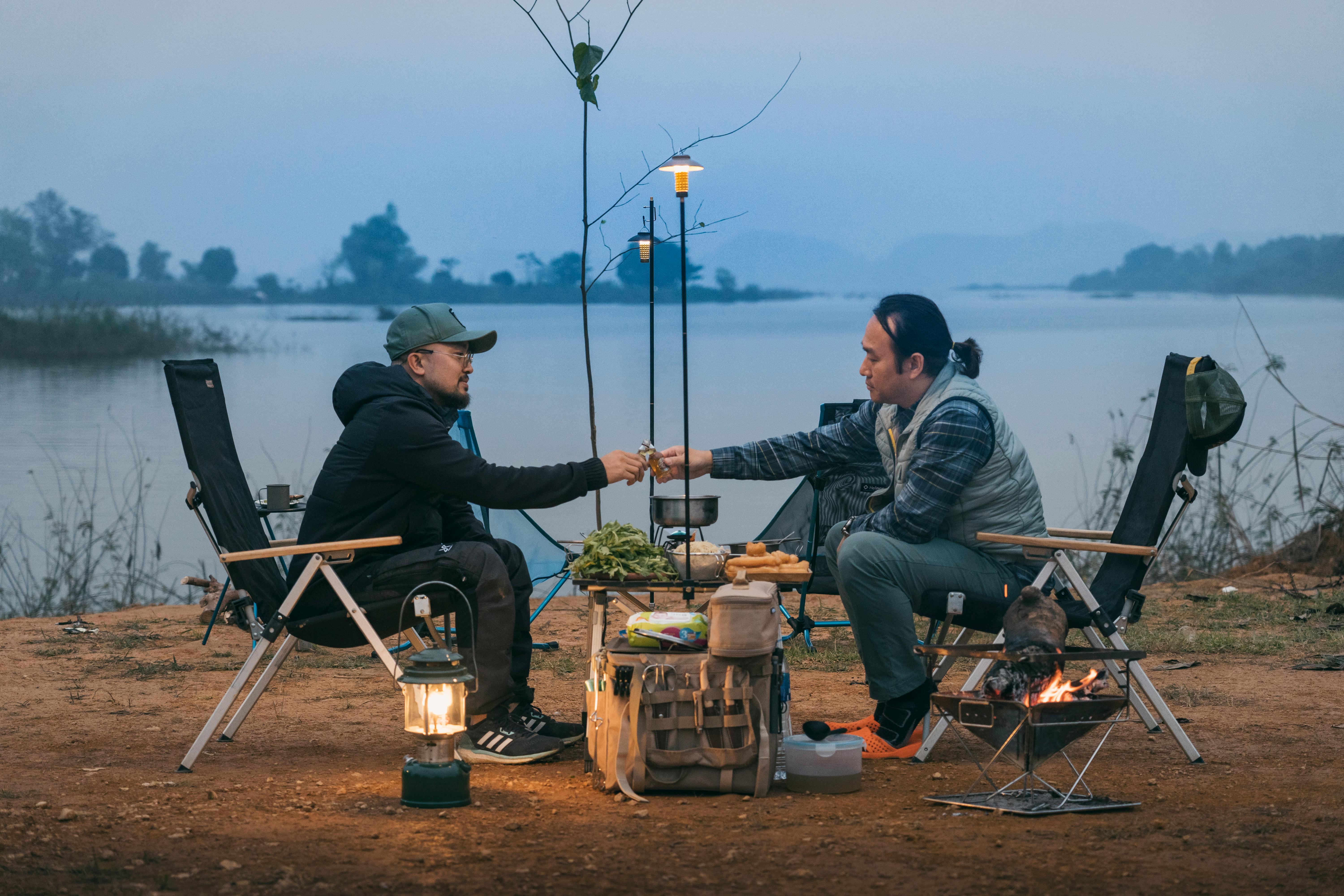 Men Camping by the Lake and Doing a Toast · Free Stock Photo