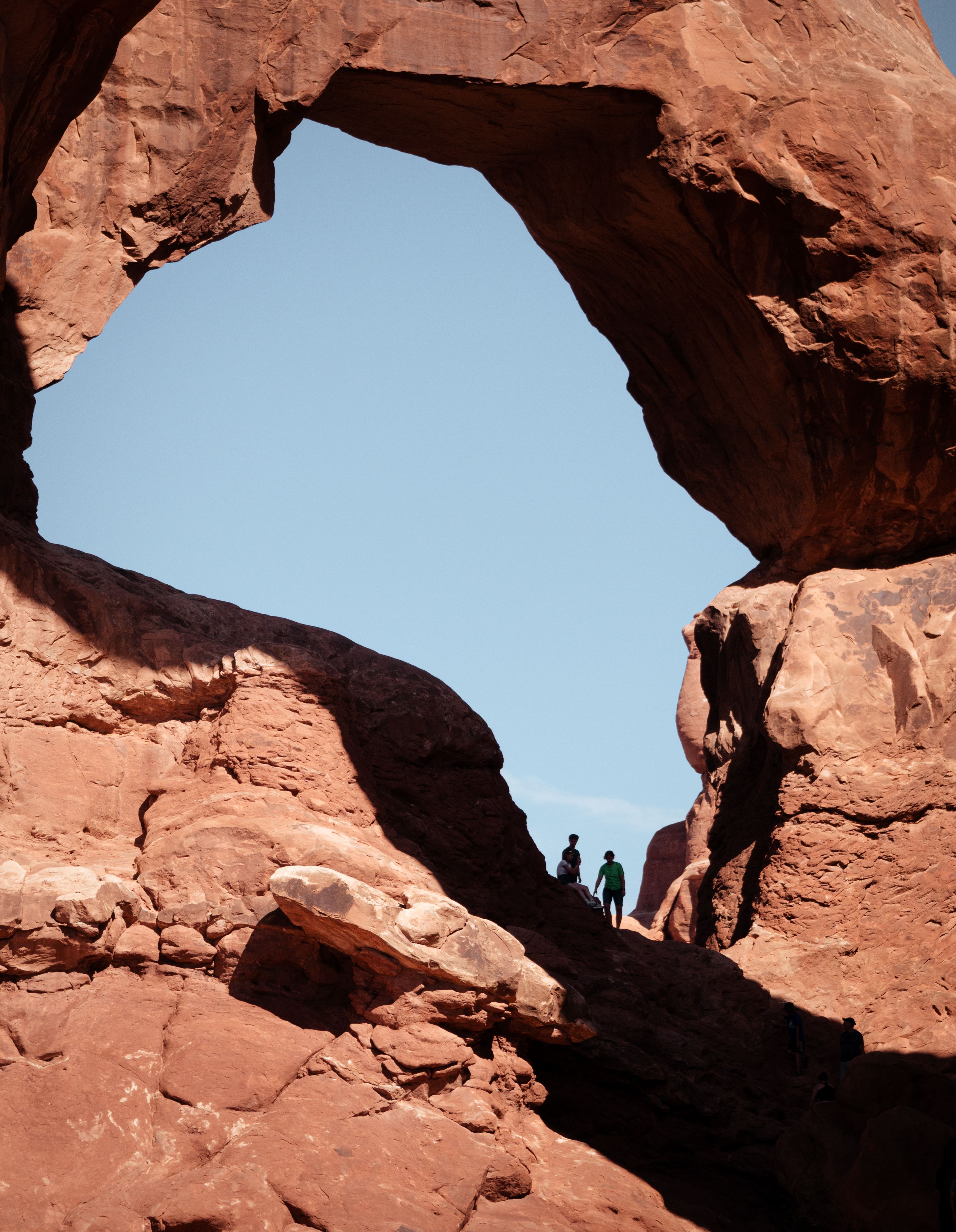 People in Geology Formation against Blue Sky · Free Stock Photo