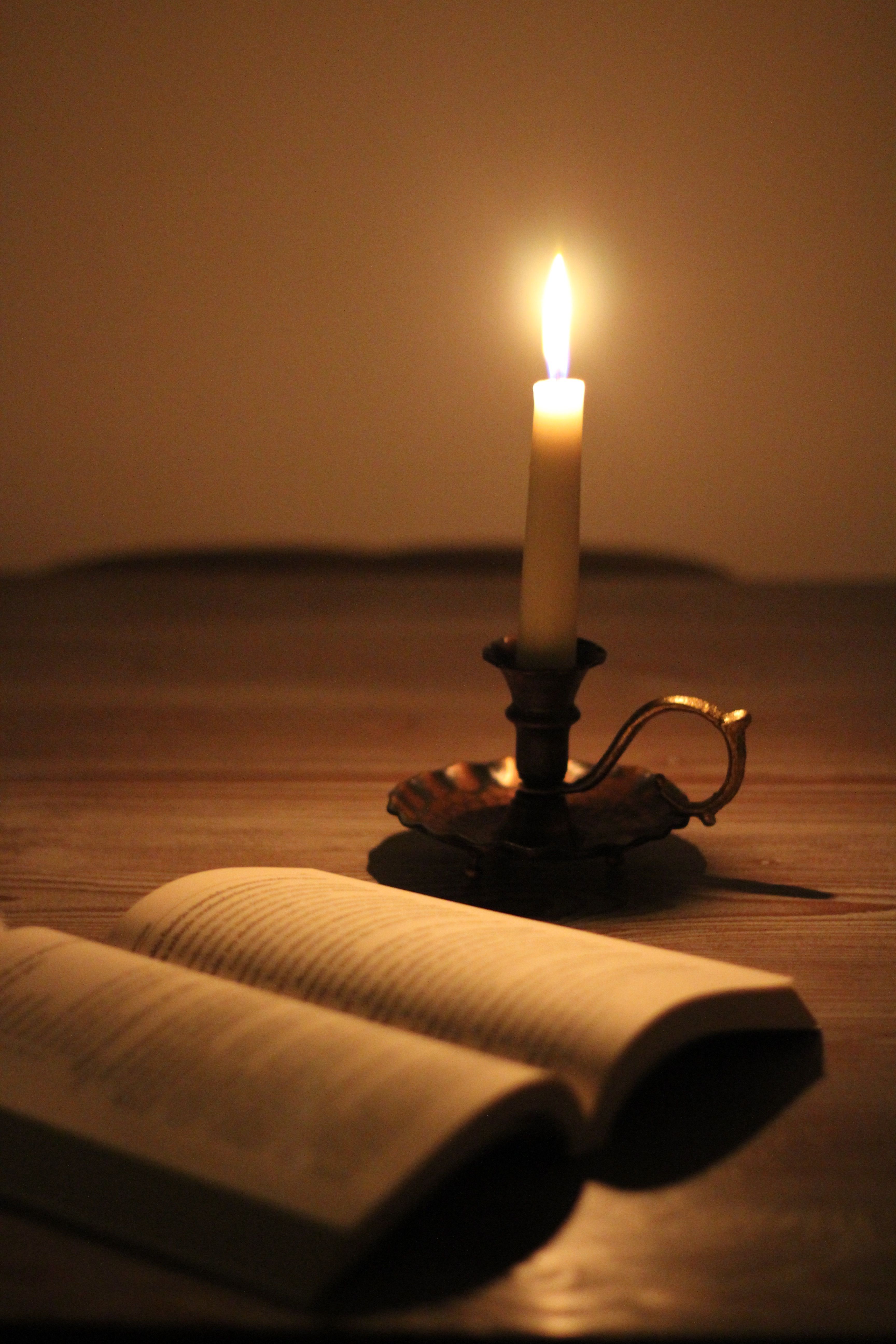 People Lighting Candles From Flame of Big Candle · Free Stock Photo
