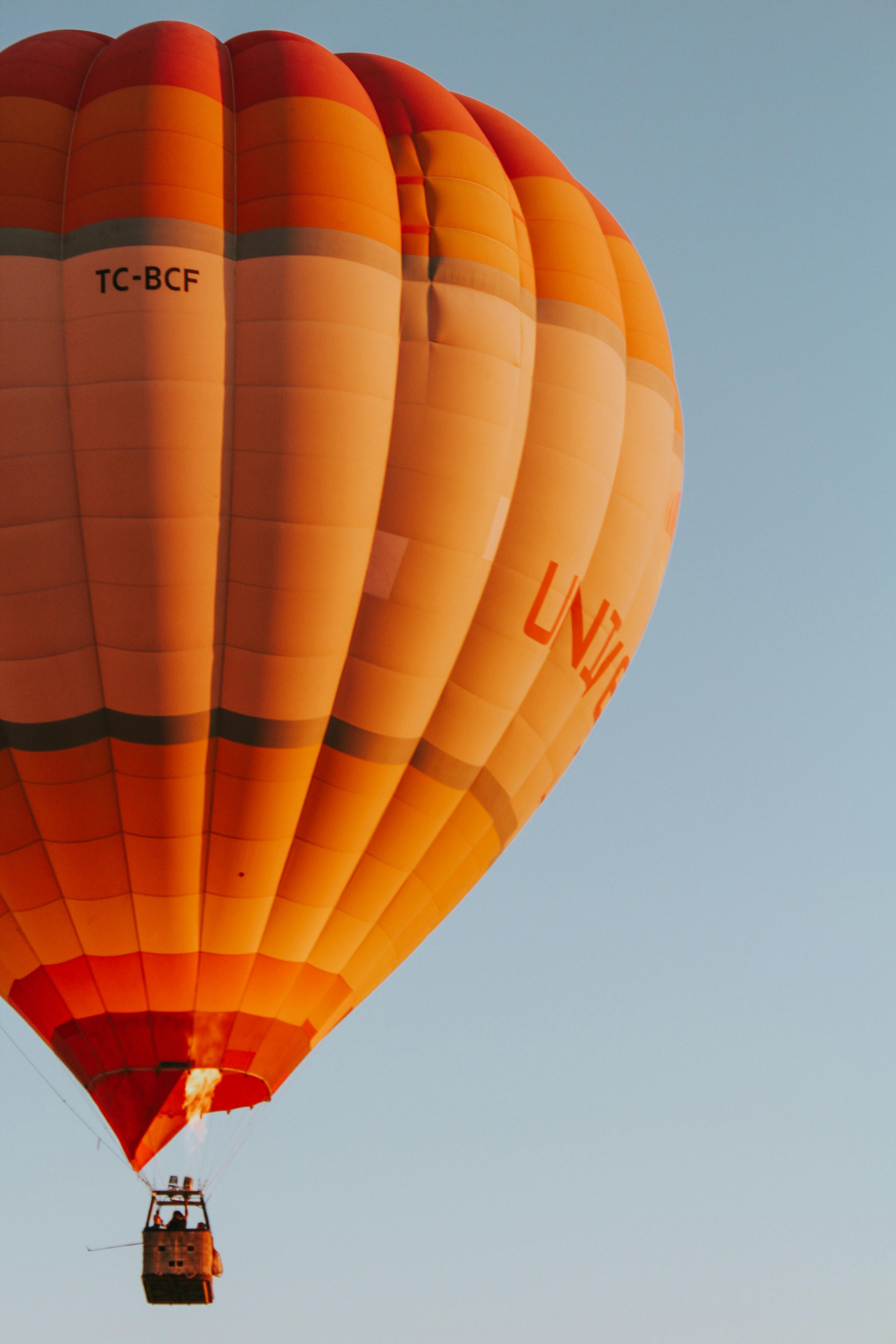 Orange Hot Air Balloon among Blue Sky · Free Stock Photo