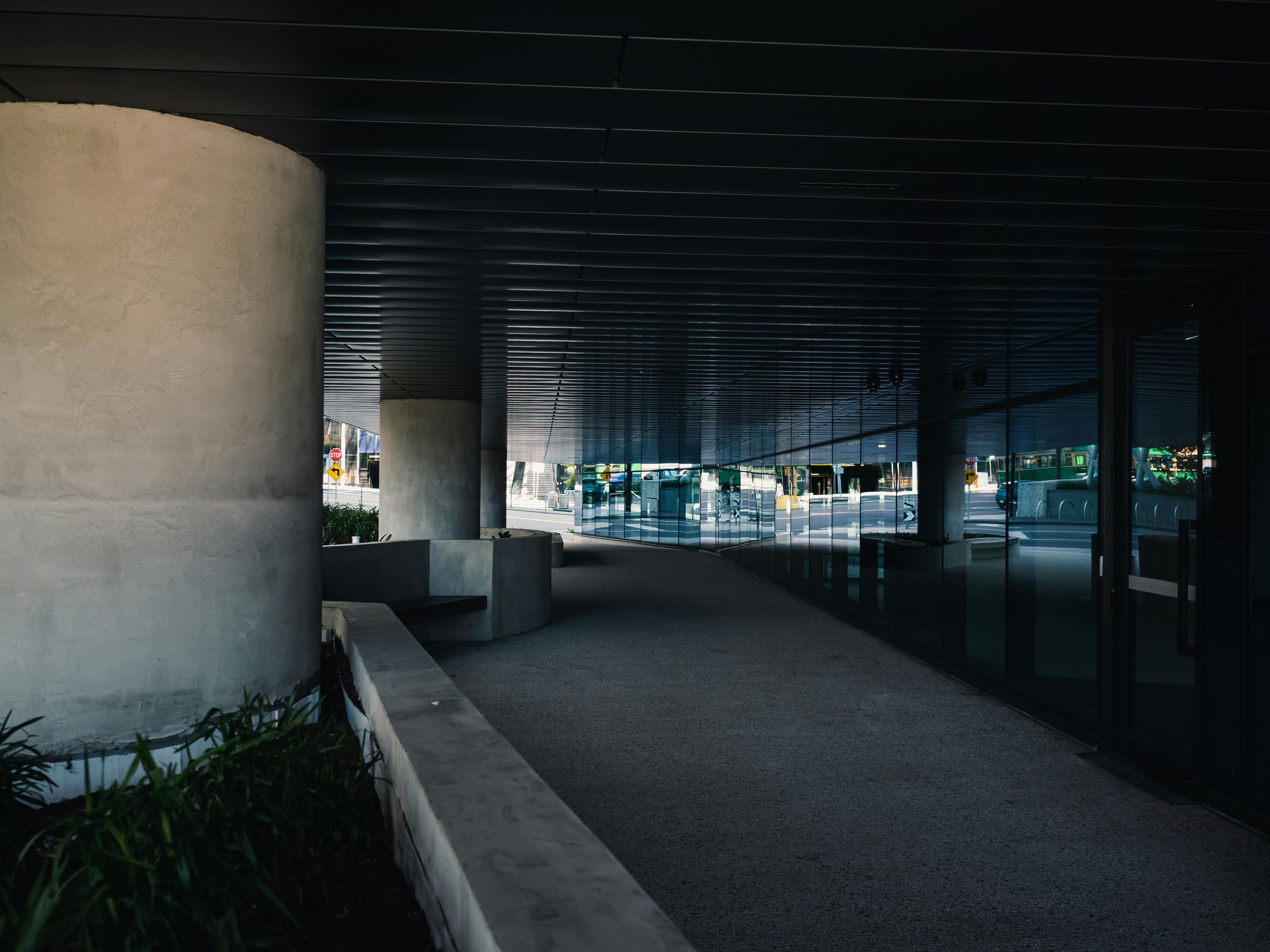 Red Brick Tenement among Modern Buildings in Downtown · Free Stock Photo