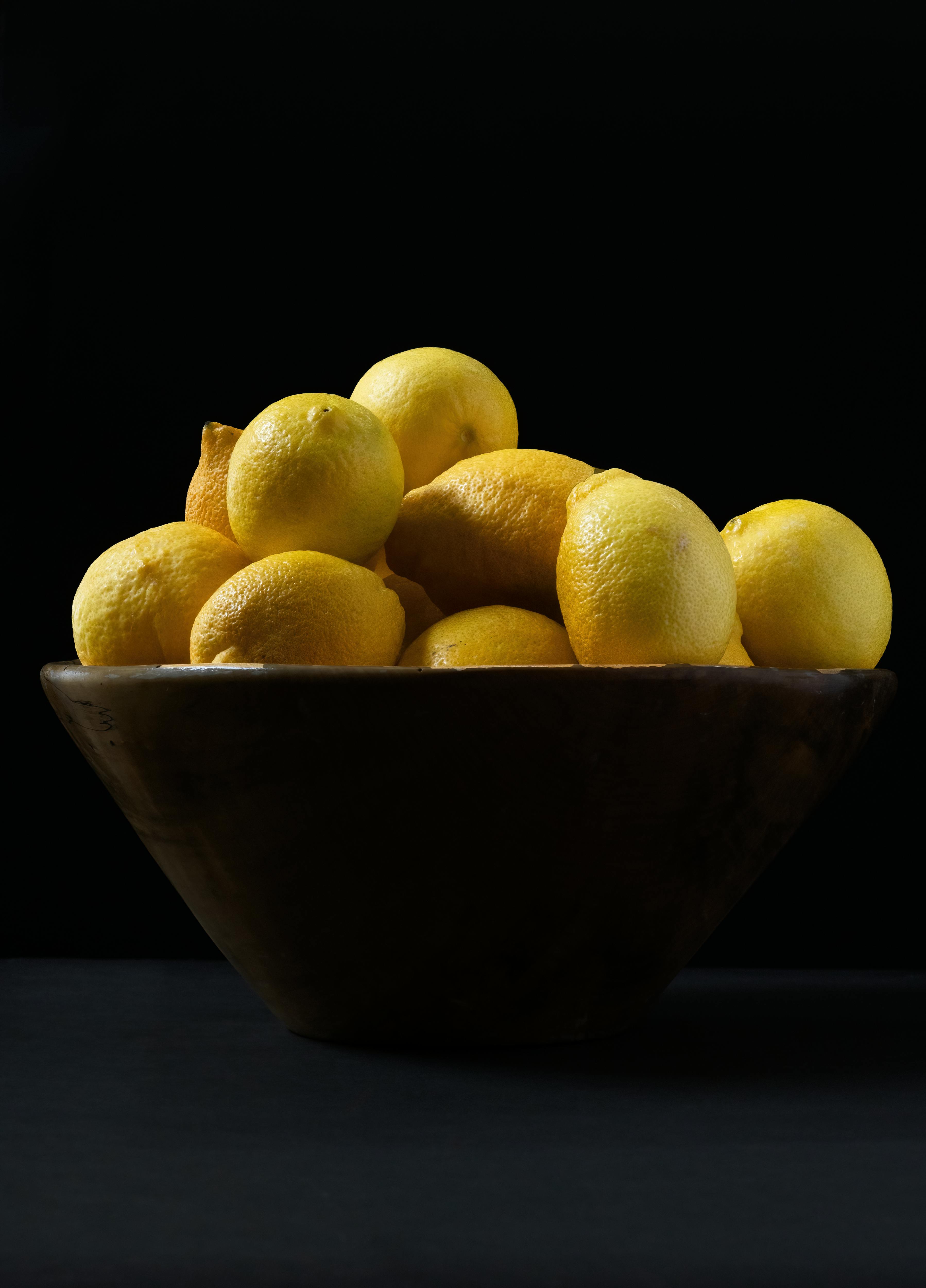 A Lemon Falling into a Bowl with Water · Free Stock Photo