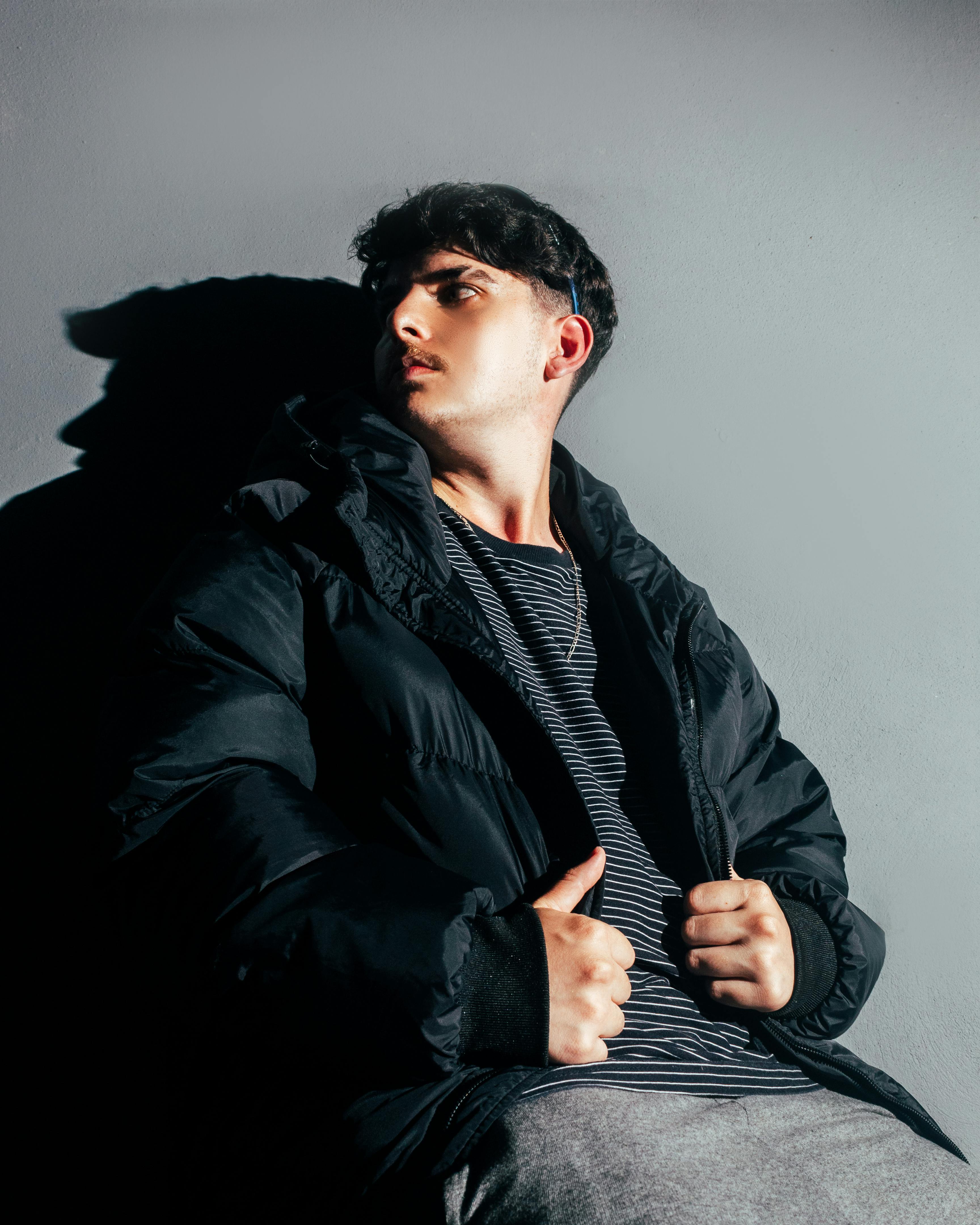 Portrait of a Man Sitting in a Chair · Free Stock Photo