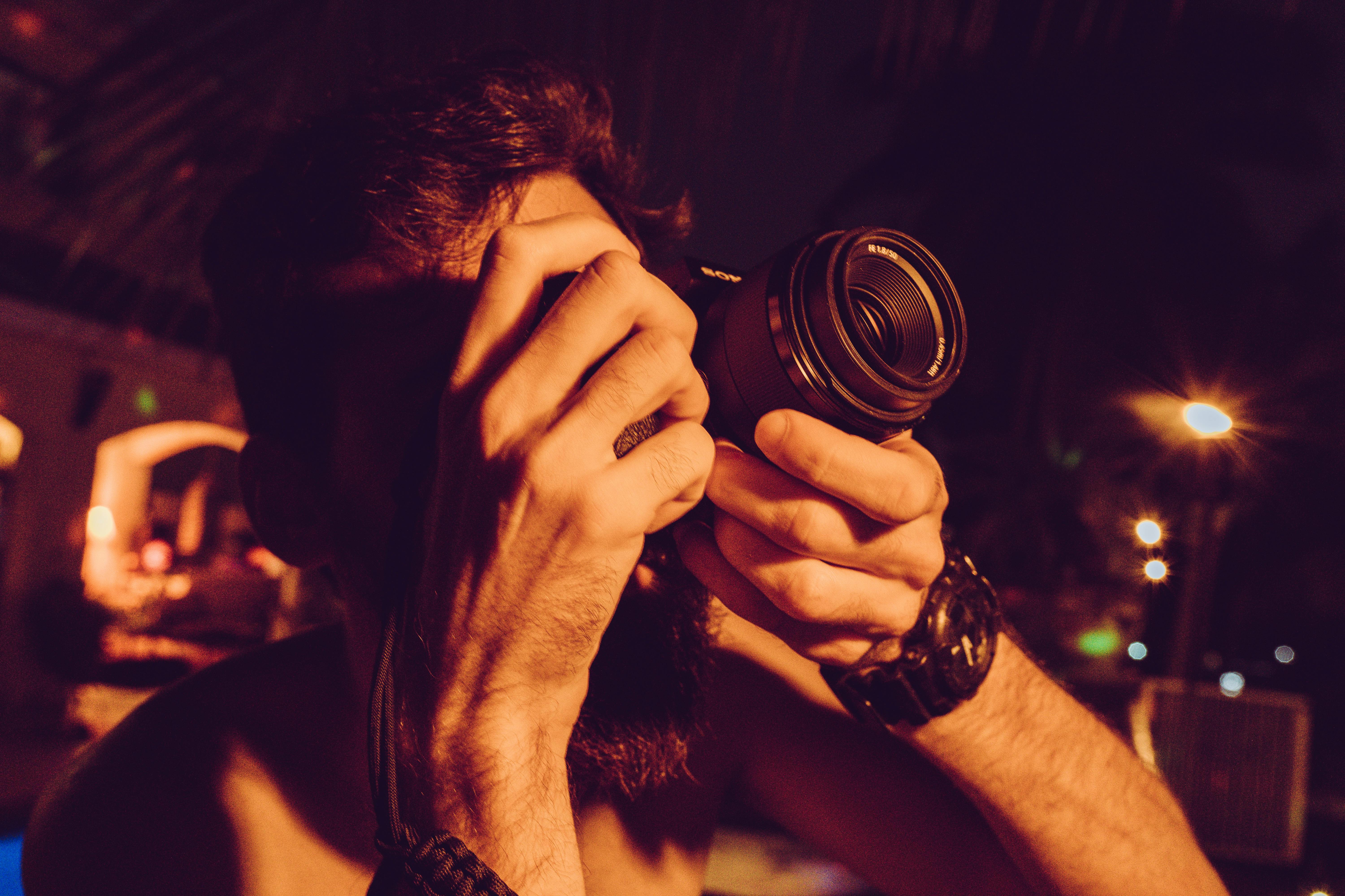 Bearded Man Taking Photo Using a Dslr Camera · Free Stock Photo