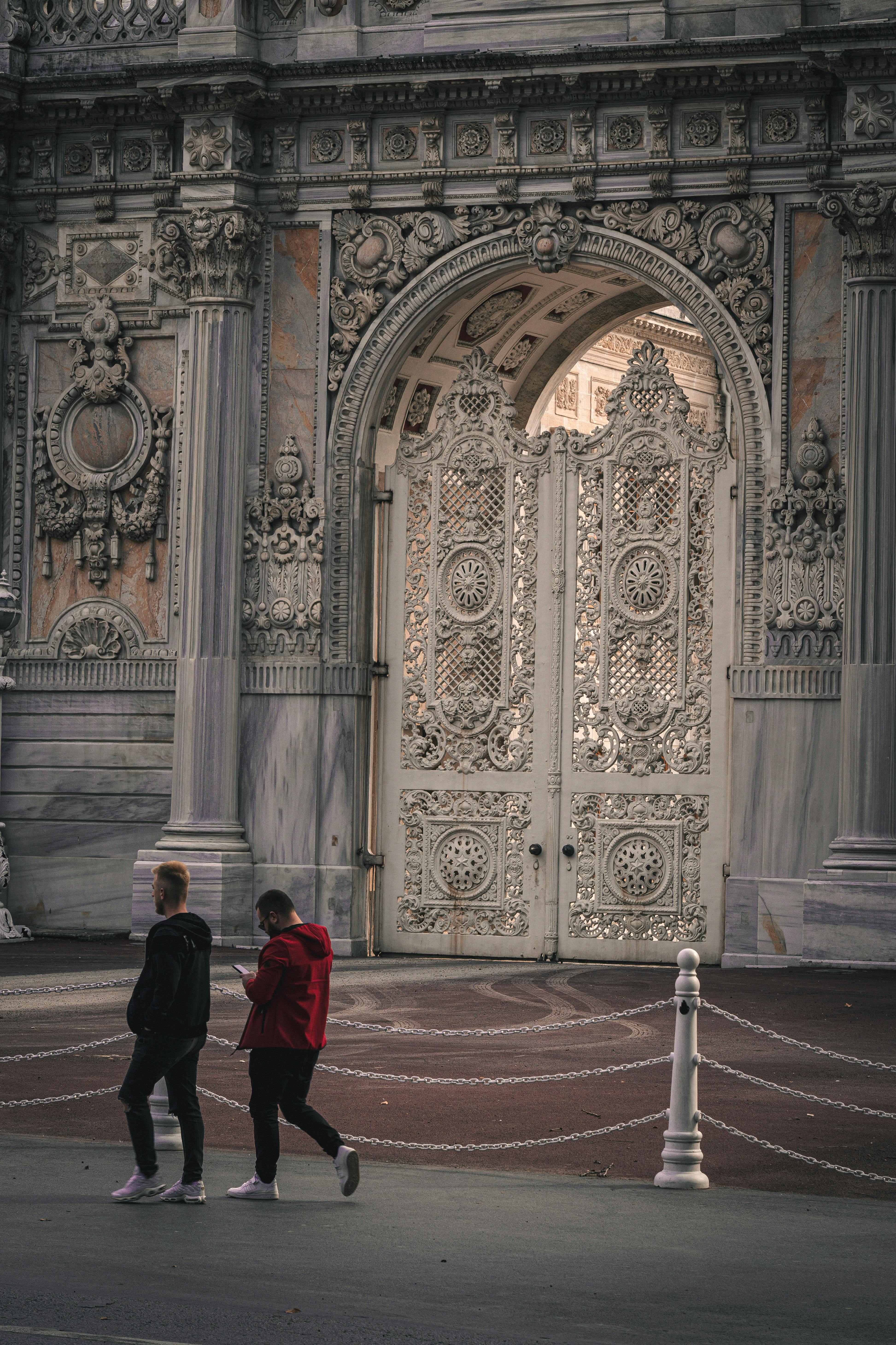 People Walking by Ornate Gate · Free Stock Photo