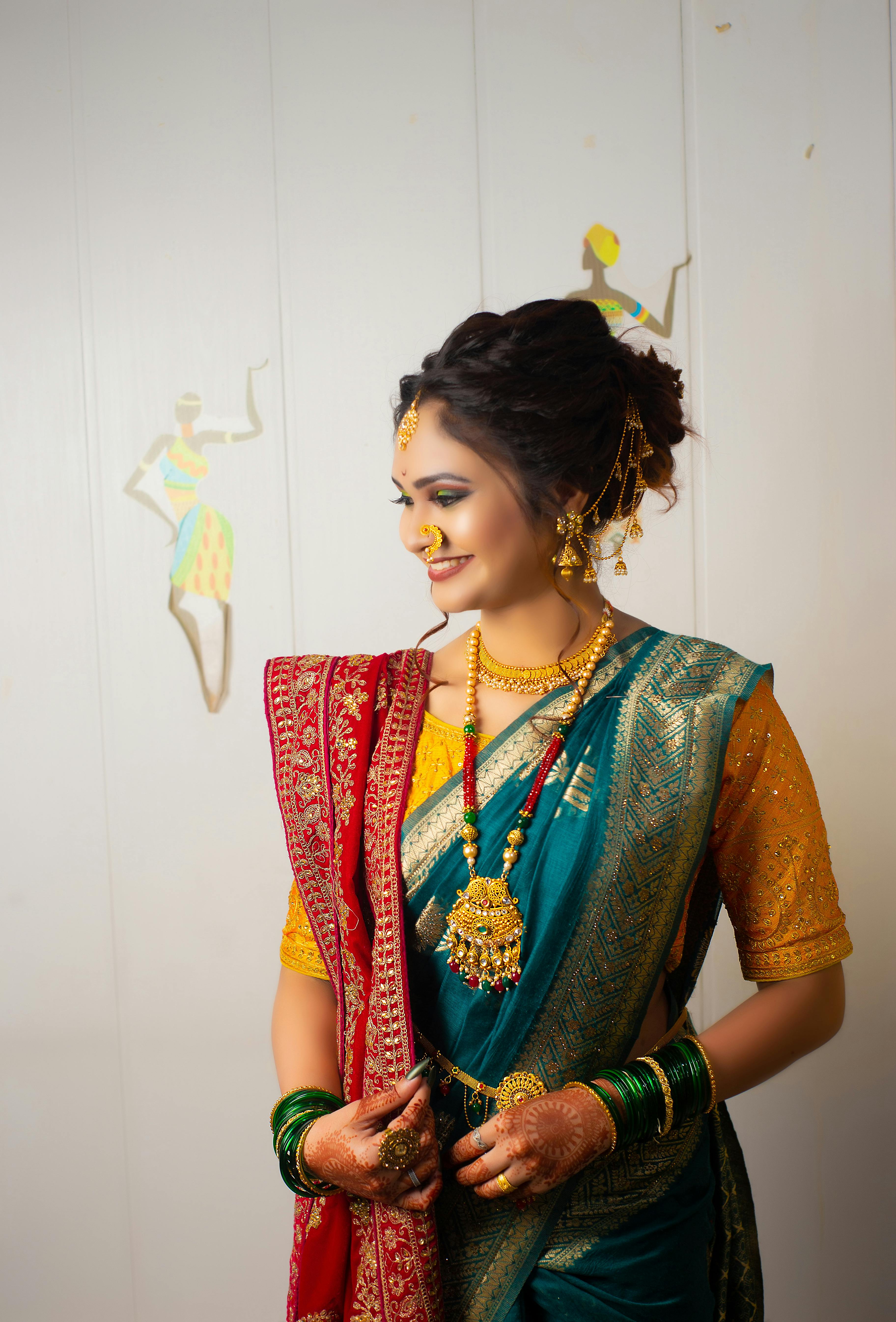 Sitting Woman in Multi Colored Traditional Dress · Free Stock Photo