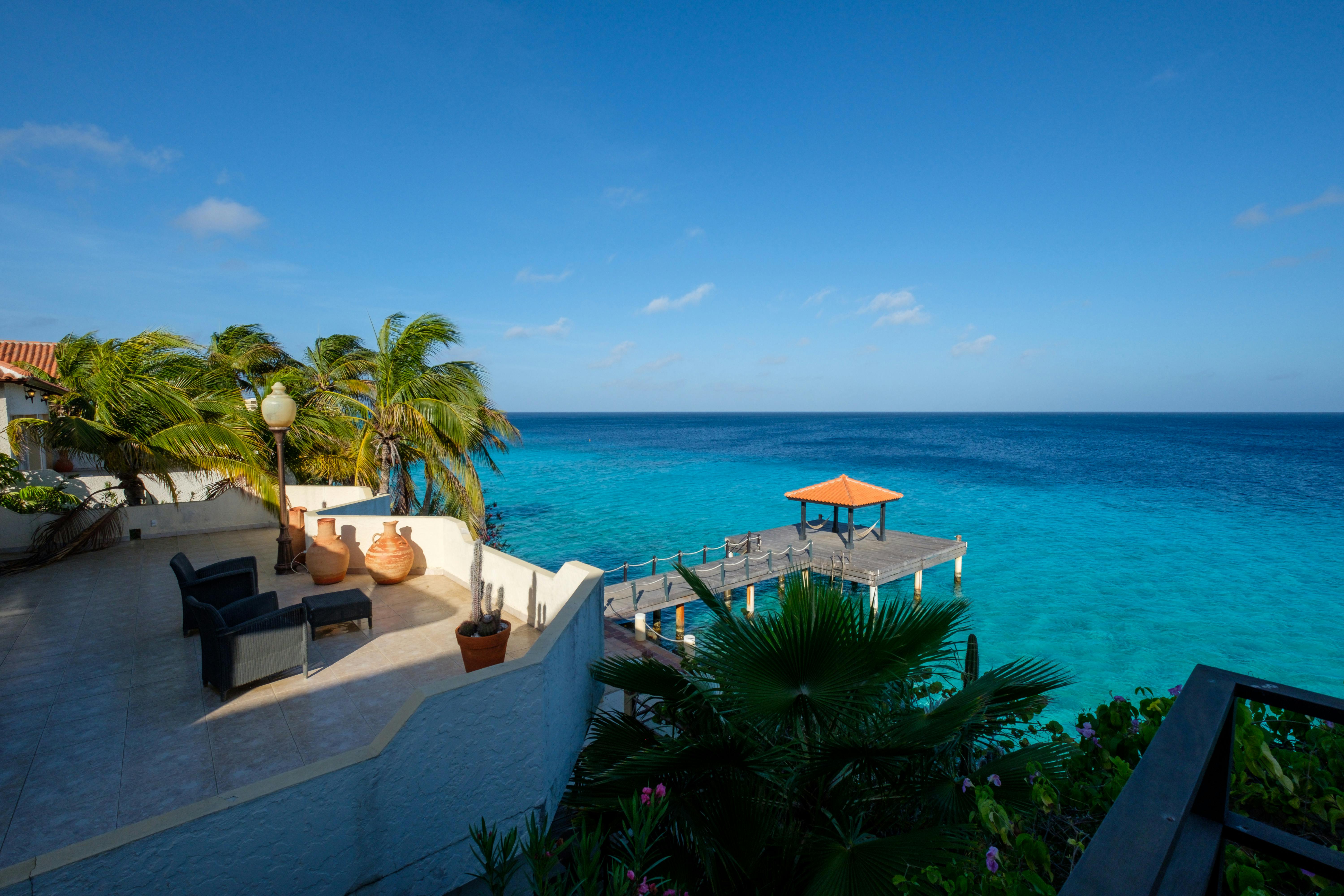 Terrace and Pier on Sea Shore under Clear Sky · Free Stock Photo