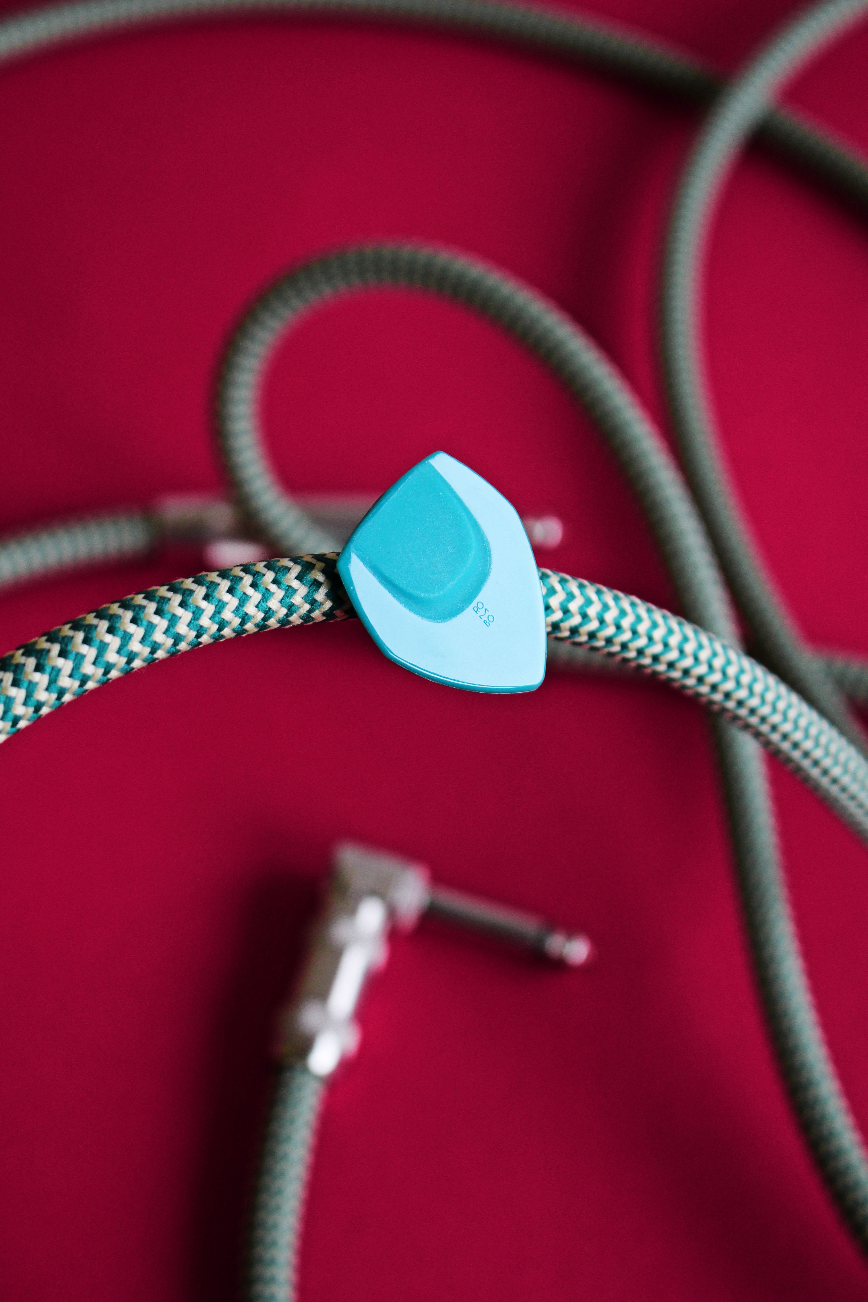 Guitar Pick and Cords on Red Background · Free Stock Photo