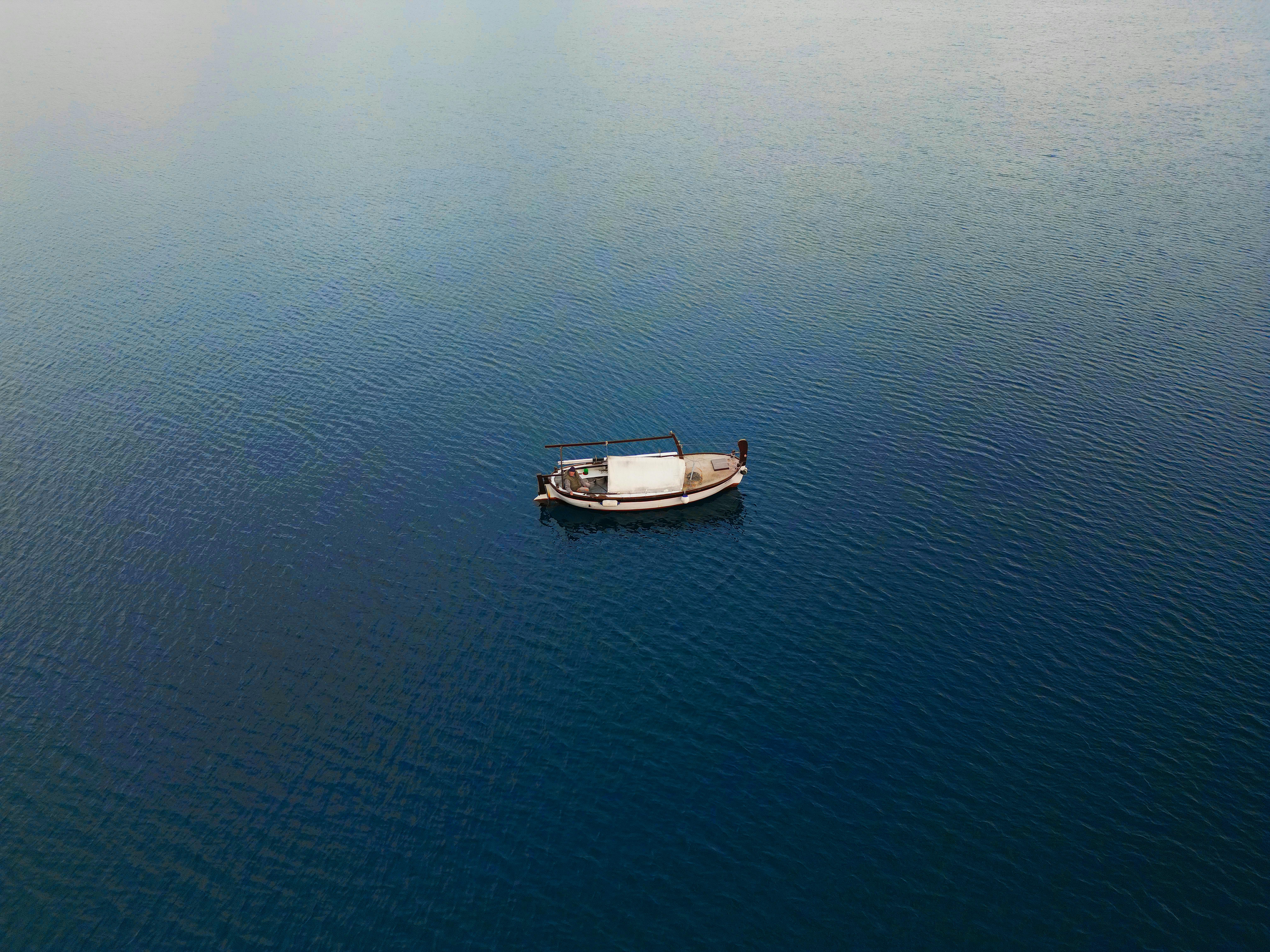 Drone Shot of a Boat on a Body of Water · Free Stock Photo