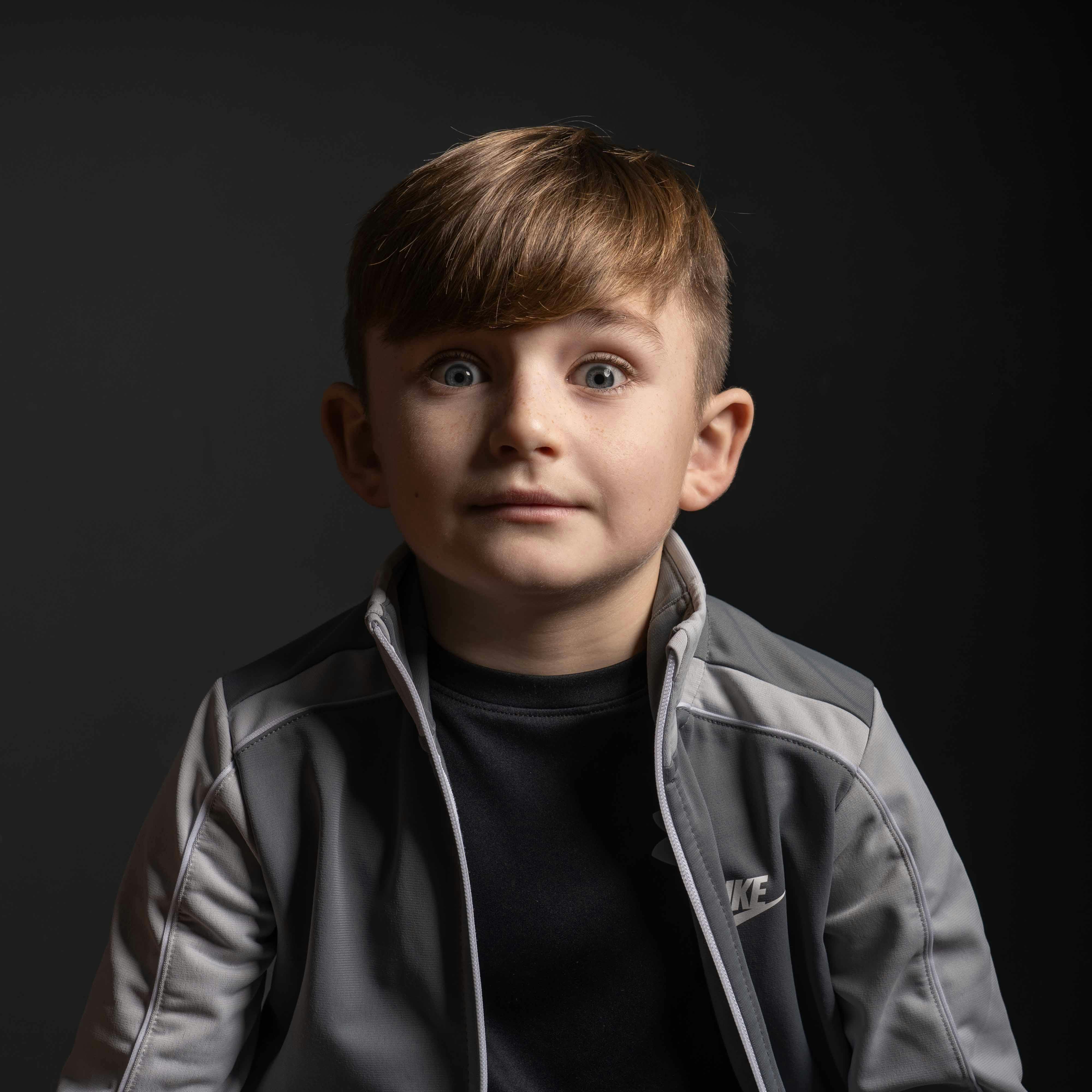 Close Up Photo of Boy Wearing Gray Jacket · Free Stock Photo