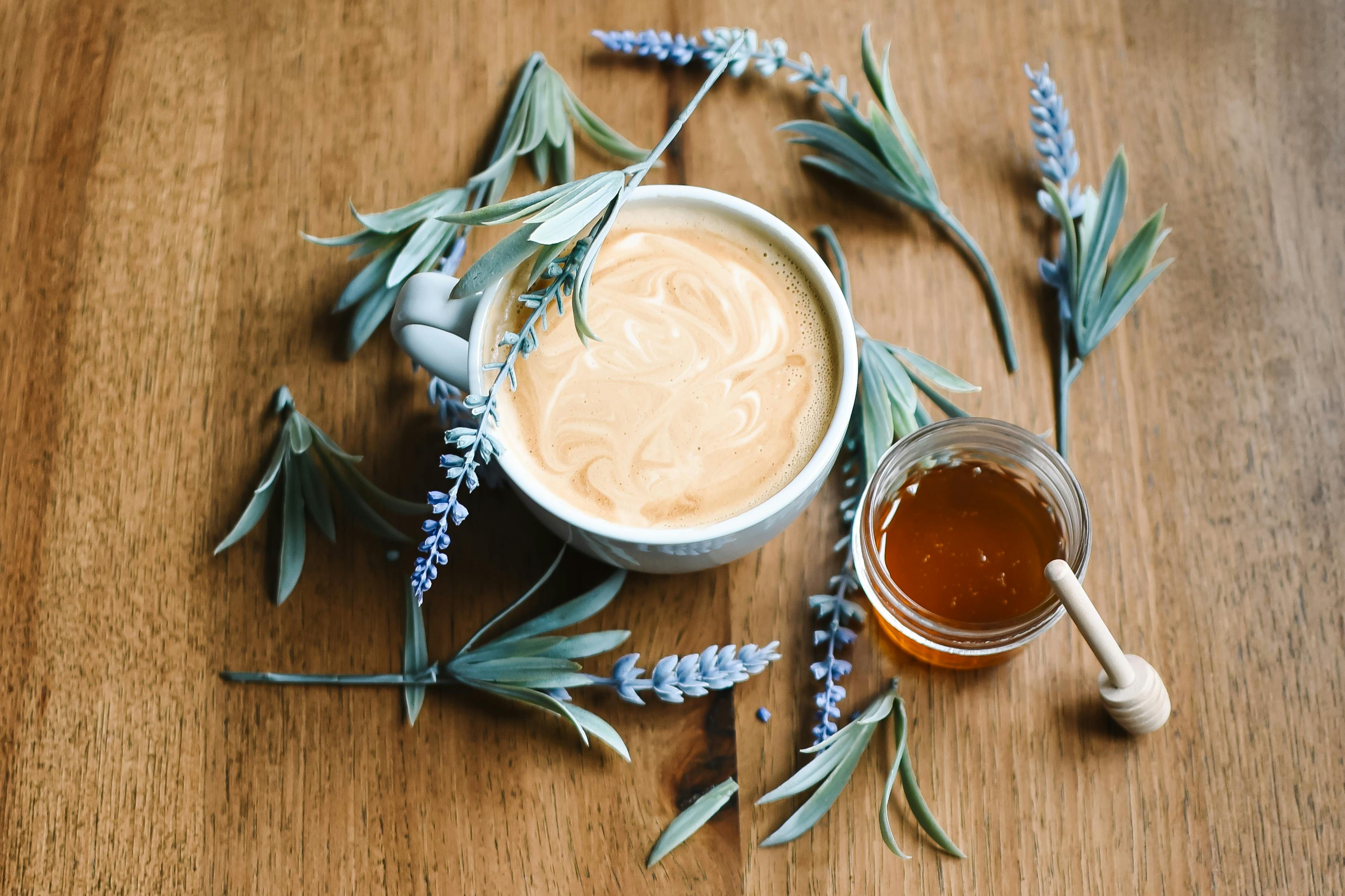 A Teaspoonful of Honey over the Bottle · Free Stock Photo