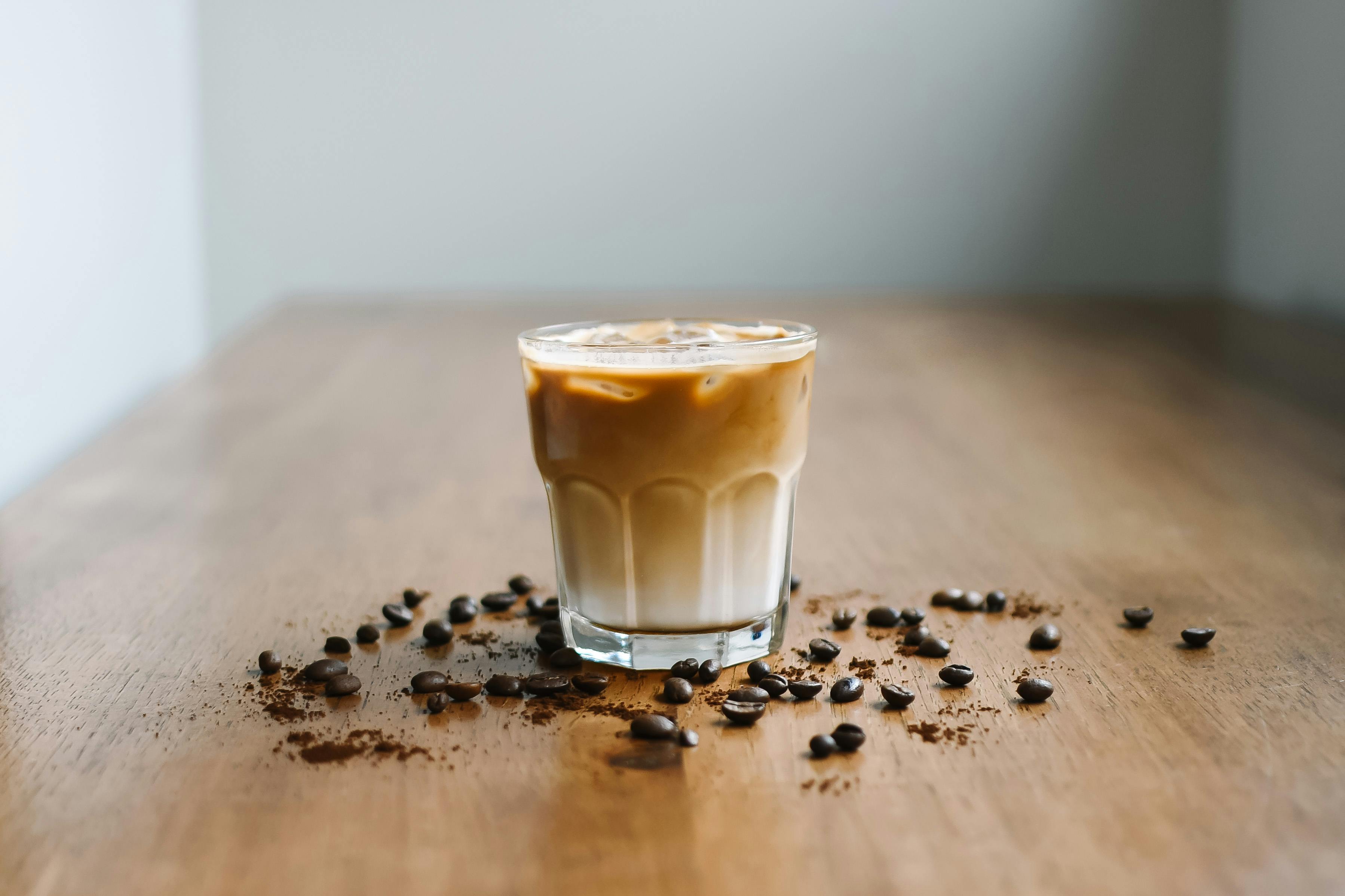 A Glass of Coffee on a Wooden Surface · Free Stock Photo