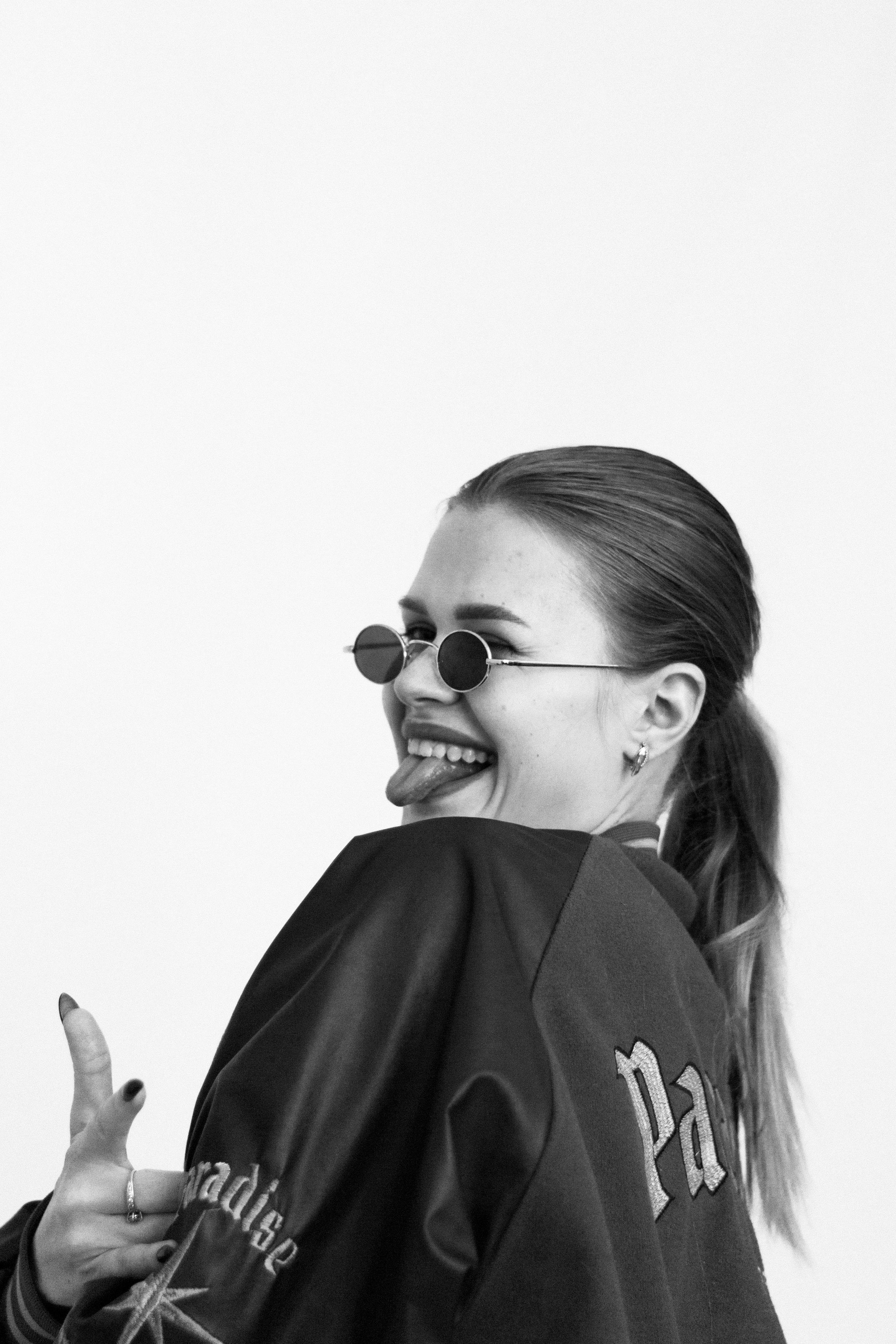 Woman in Sunglasses Showing Middle Finger · Free Stock Photo