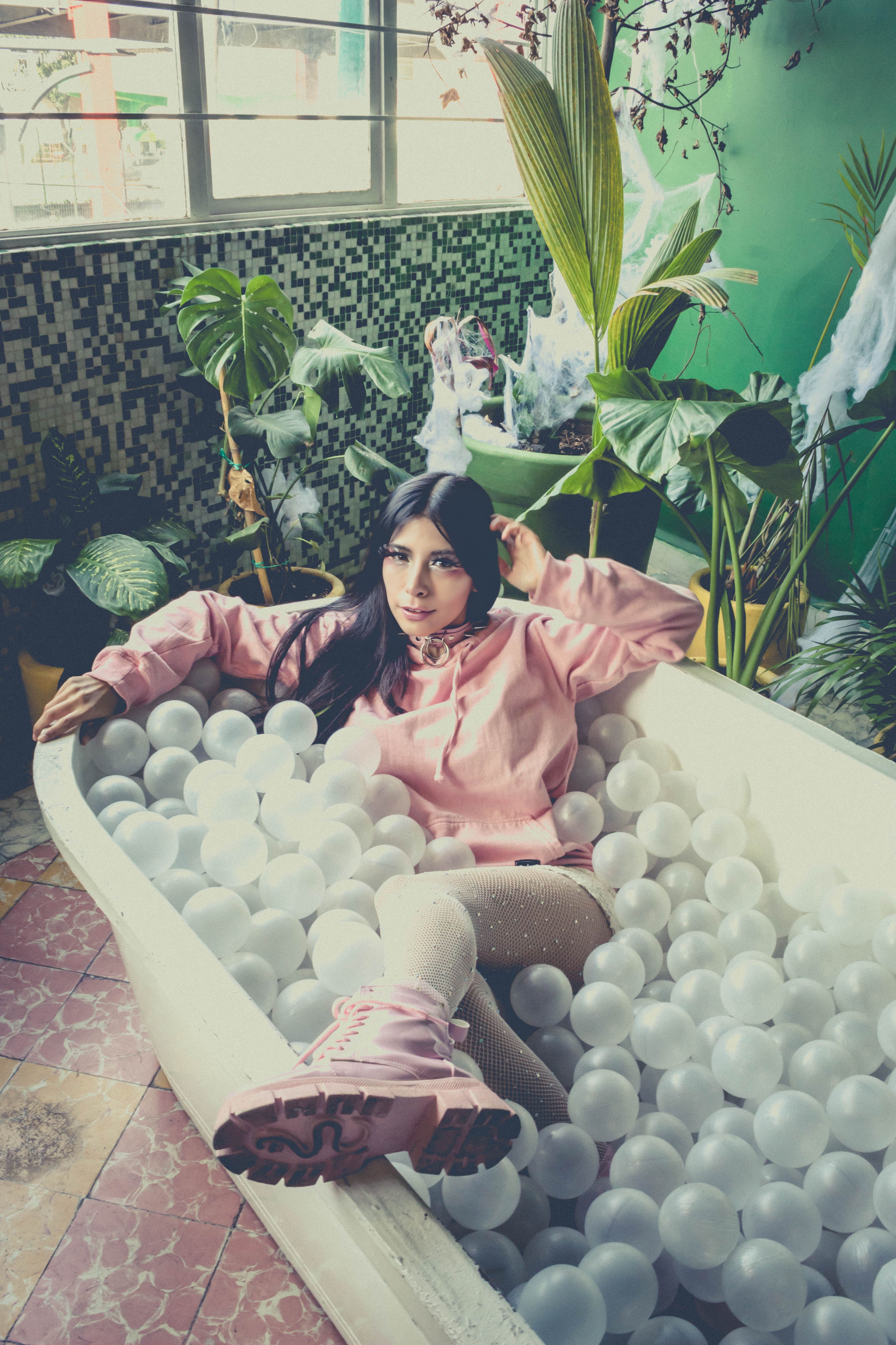 A Woman in the Bathtub with Balls · Free Stock Photo