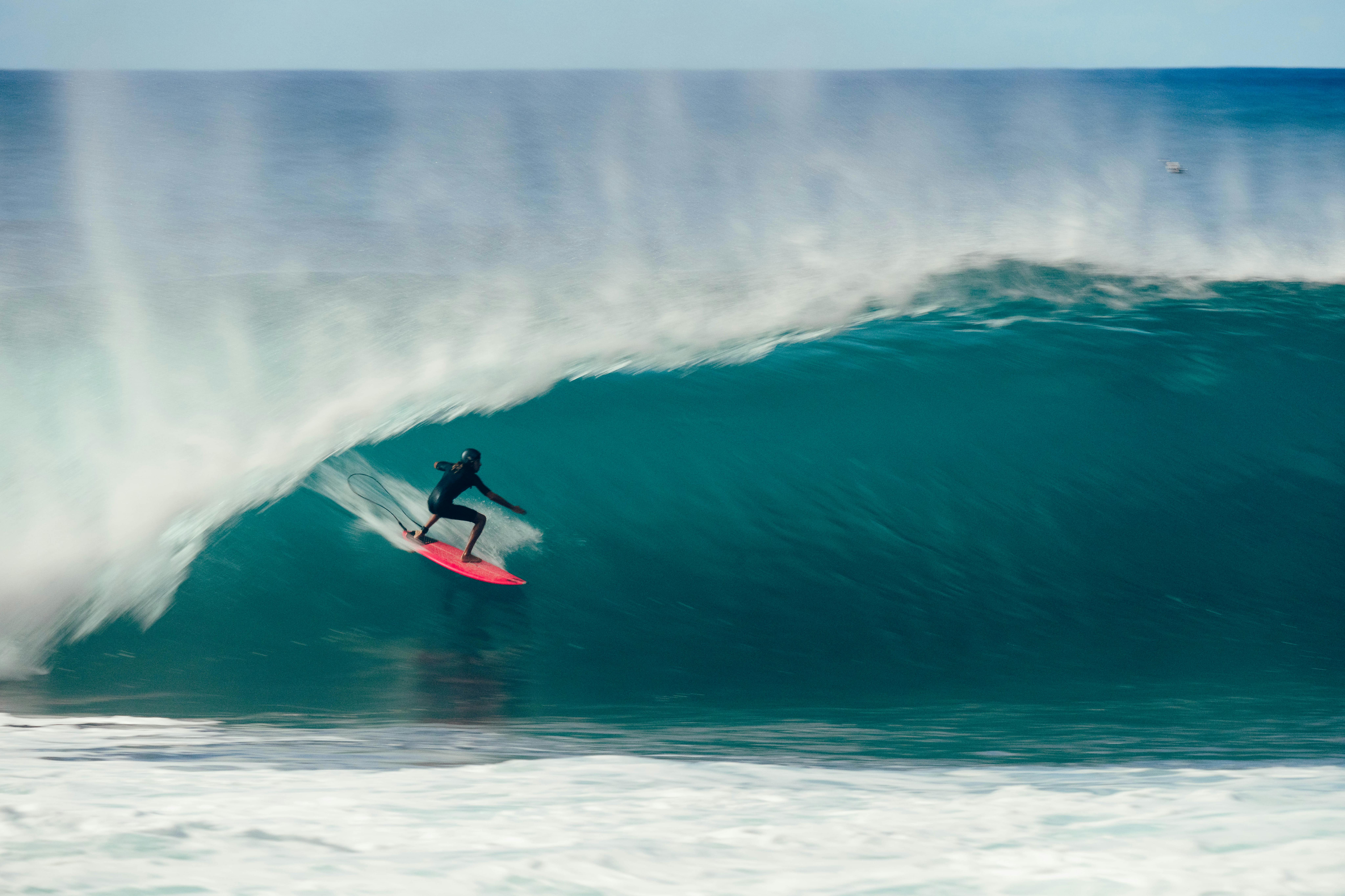 A Person Surfing on the Sea Waves · Free Stock Photo
