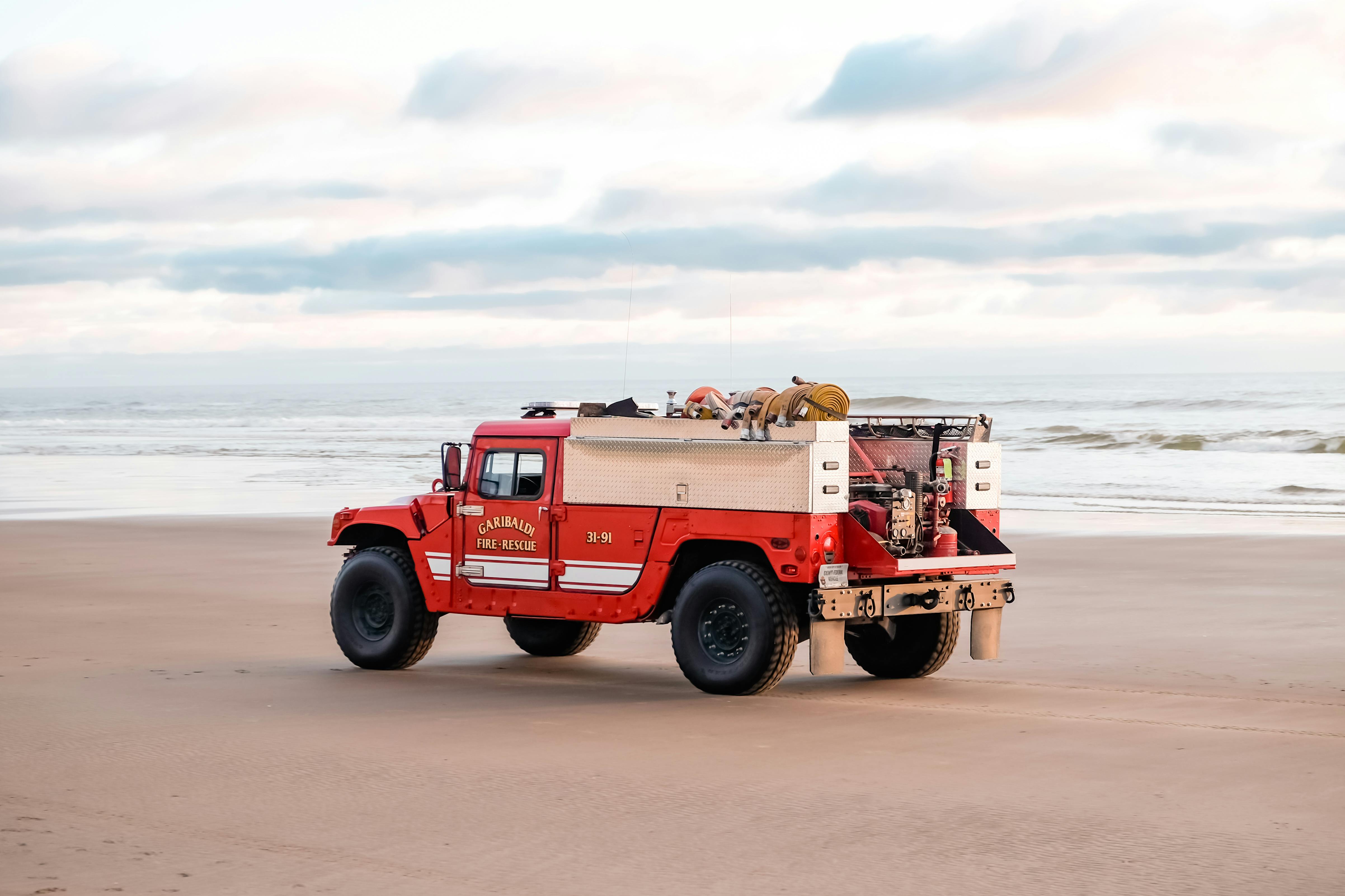 Fire Truck on the Sea Shore · Free Stock Photo