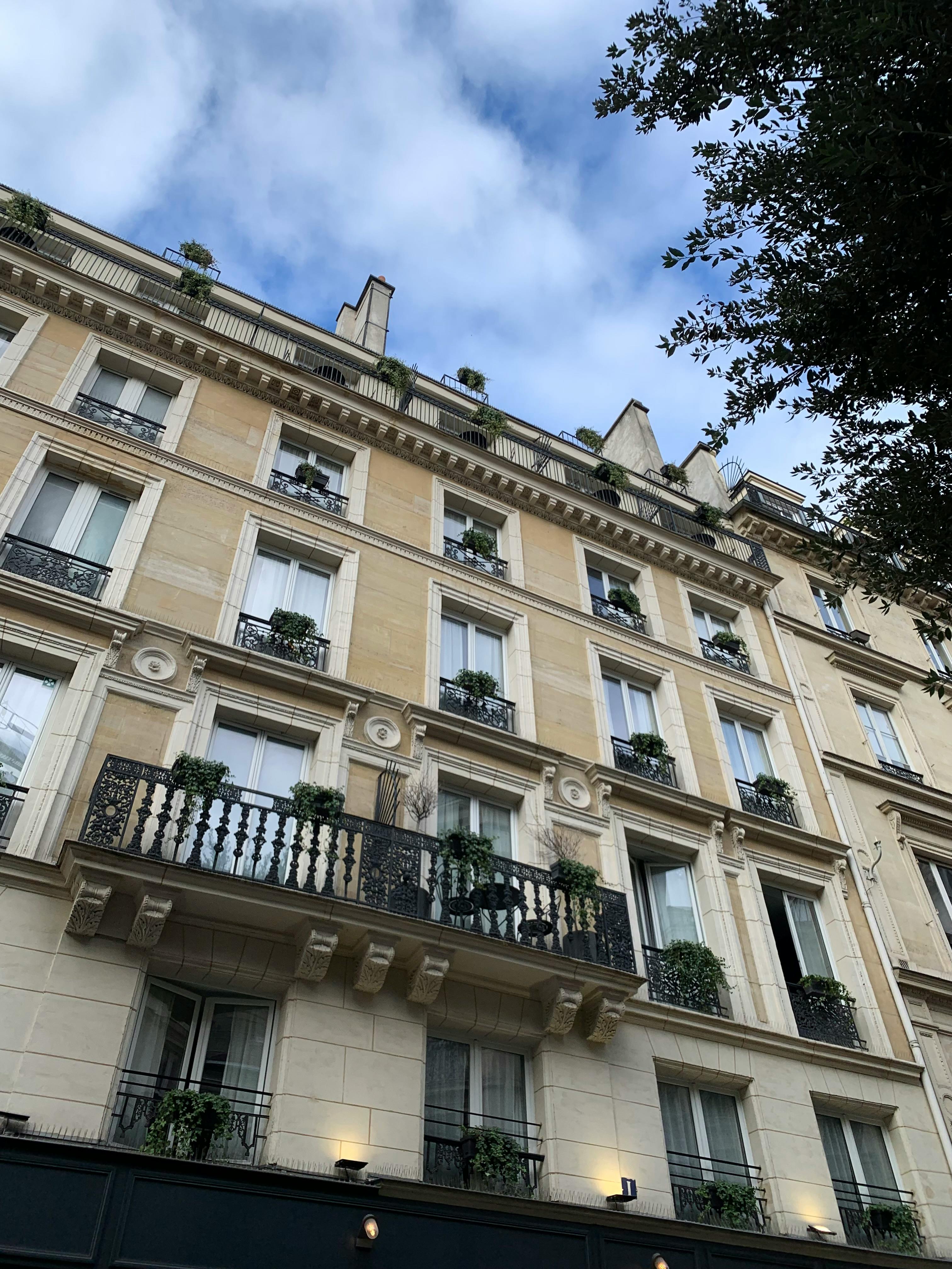 Classic Apartment Building with Balconies against Blue Sky · Free Stock ...