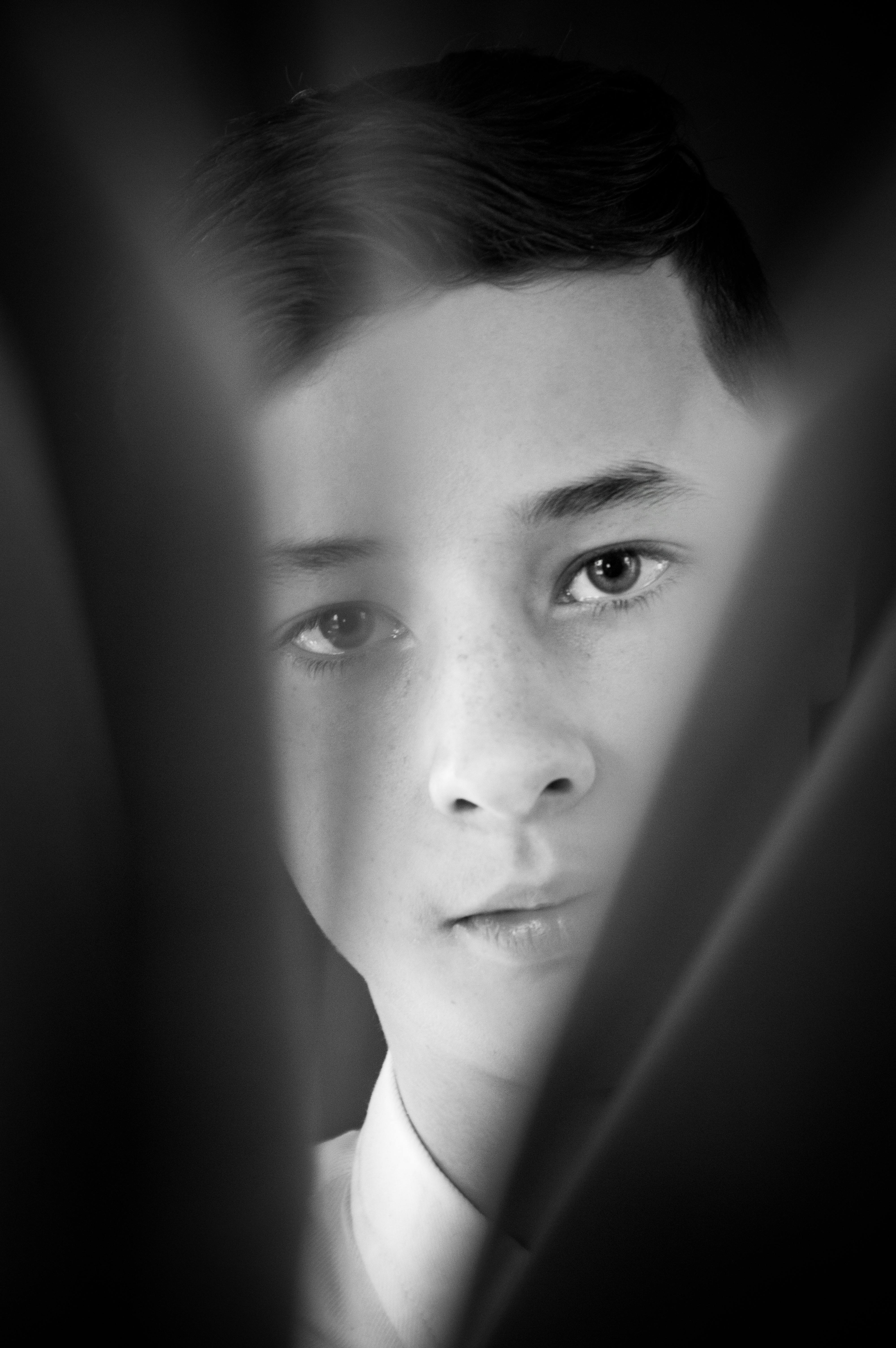 Grayscale Photo of a Boy's Face · Free Stock Photo