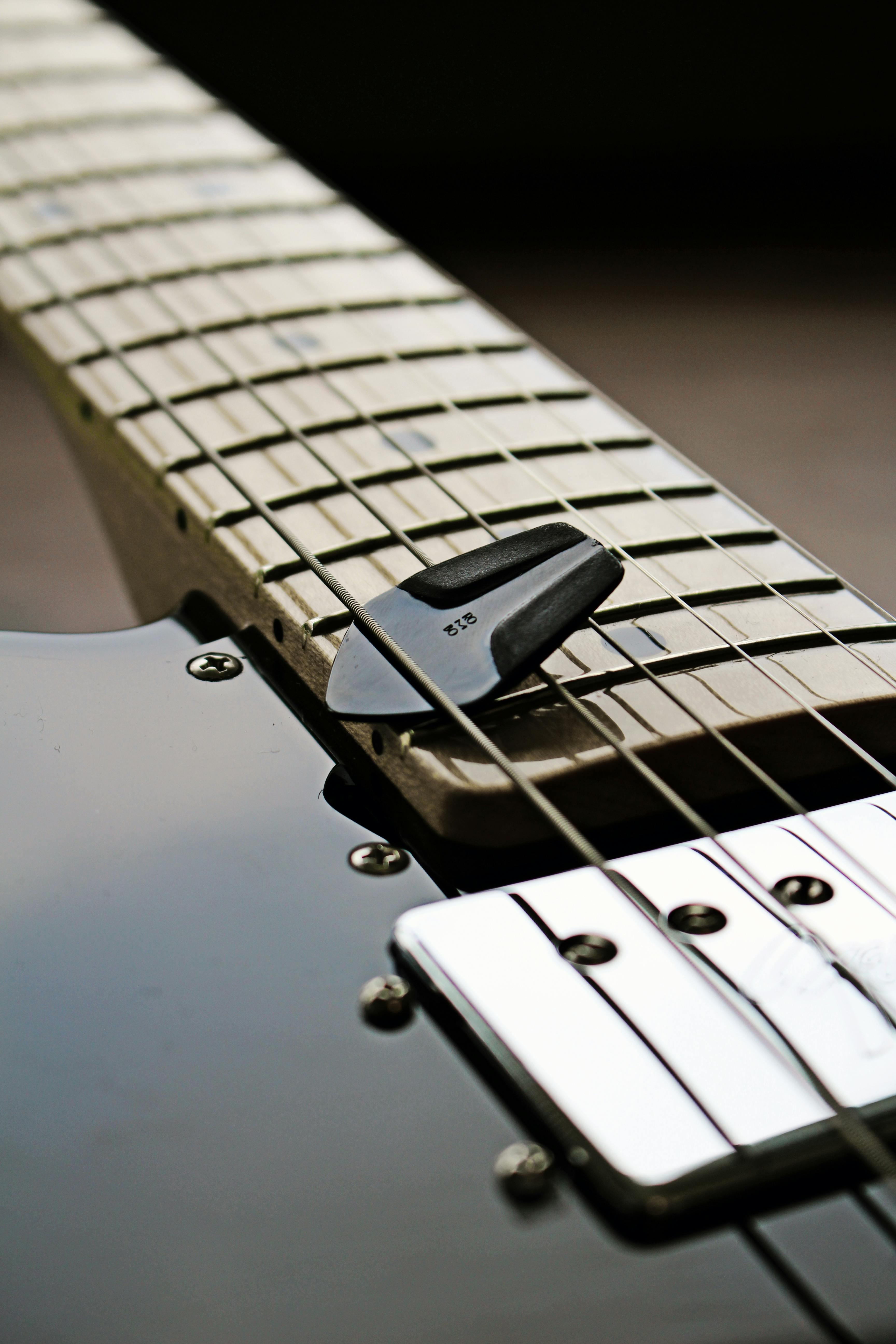 Close Up Photo of Black Plectrum on Electric Guitar · Free Stock Photo