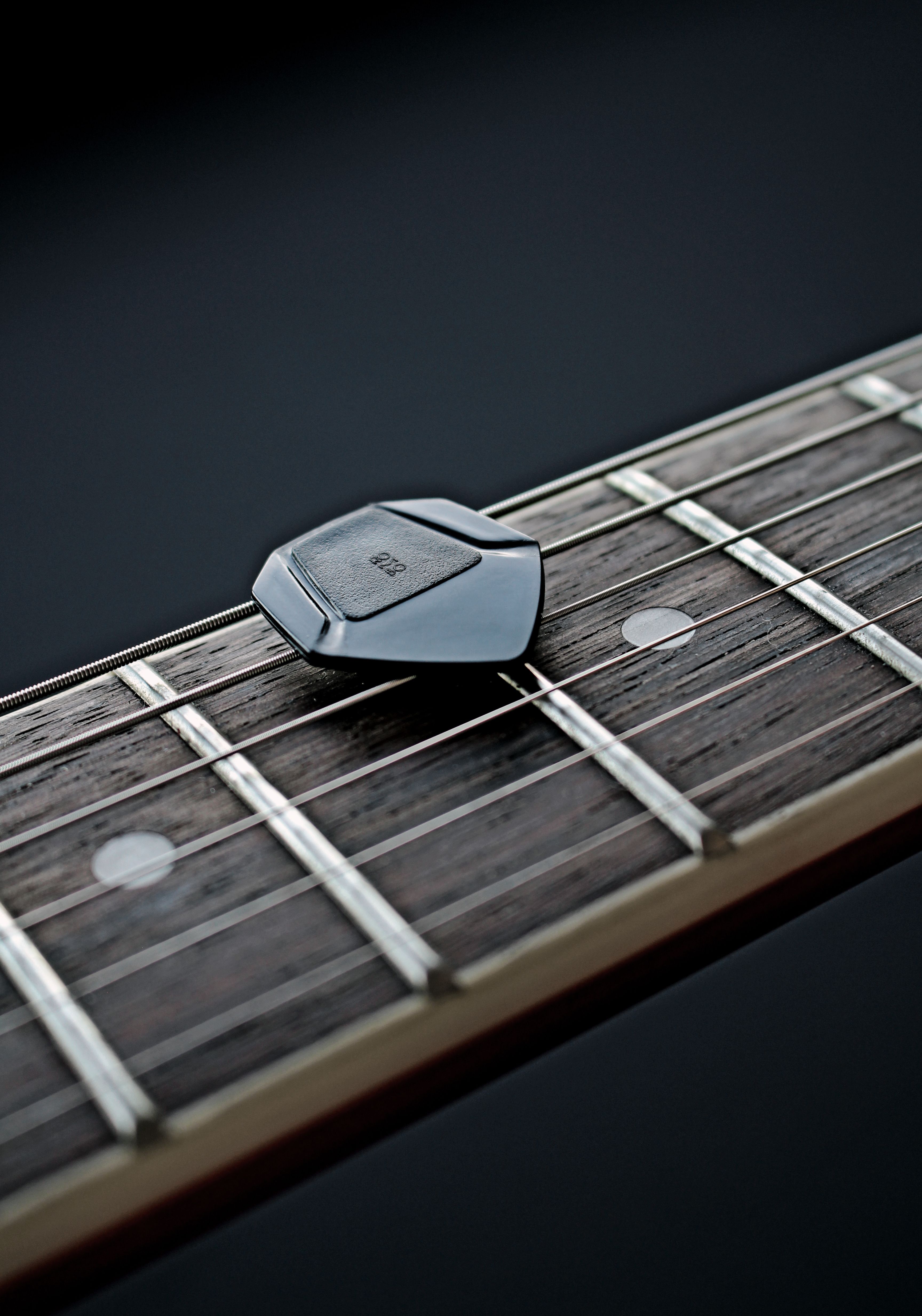 Guitar Pick on Cords · Free Stock Photo