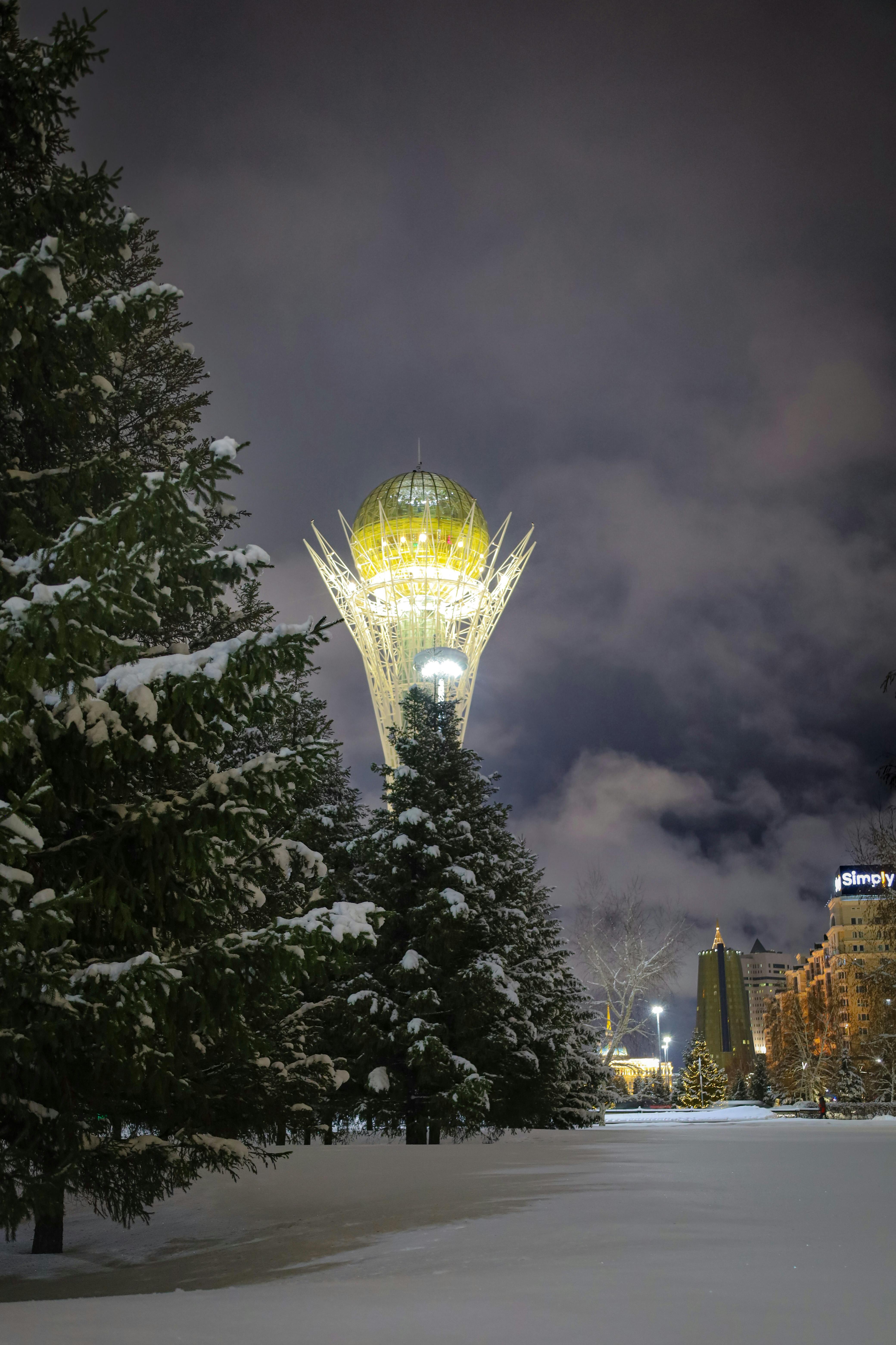 Illuminated Tower in City in Winter at Night · Free Stock Photo