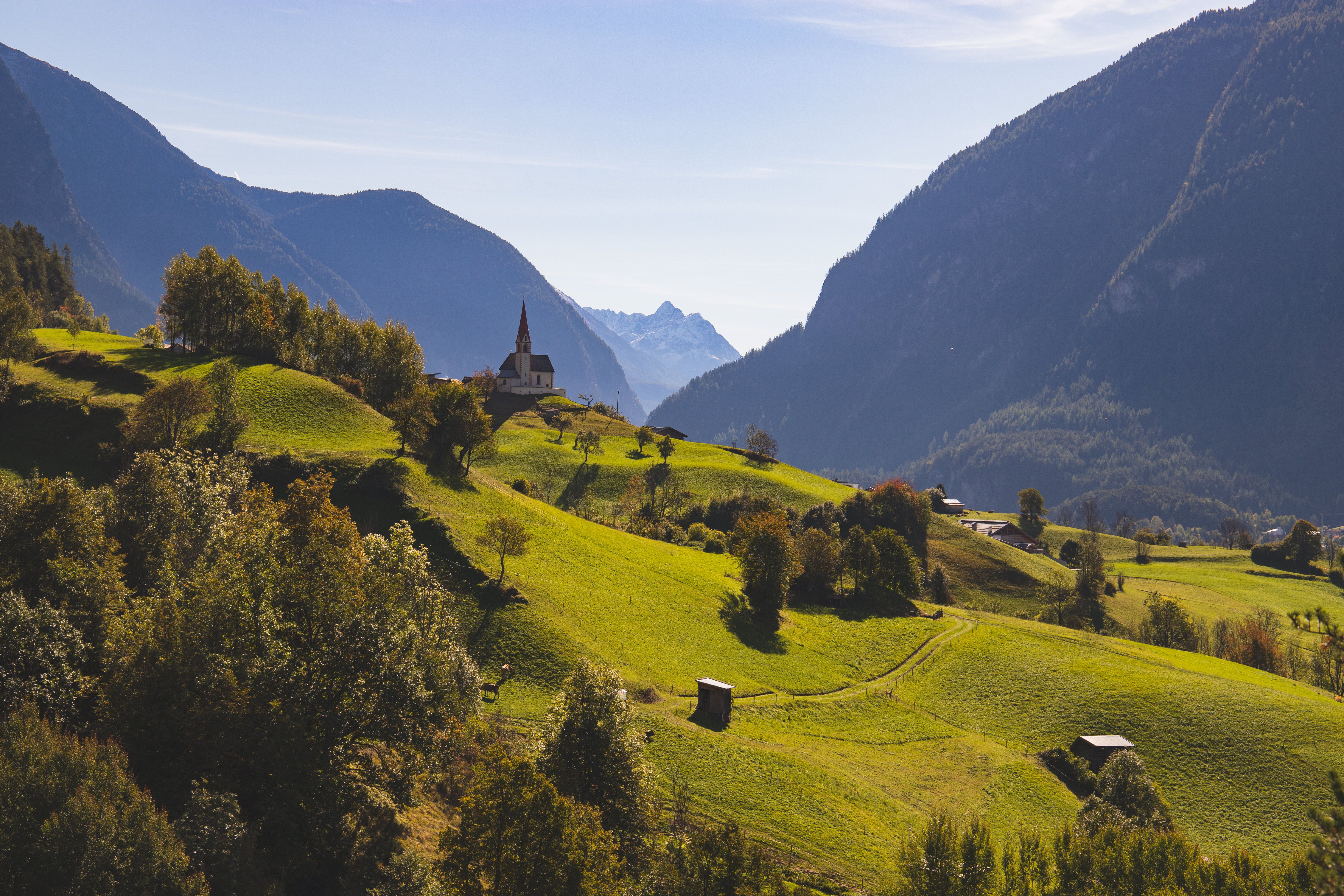 Castle in Green Valley near Rock Mountains · Free Stock Photo
