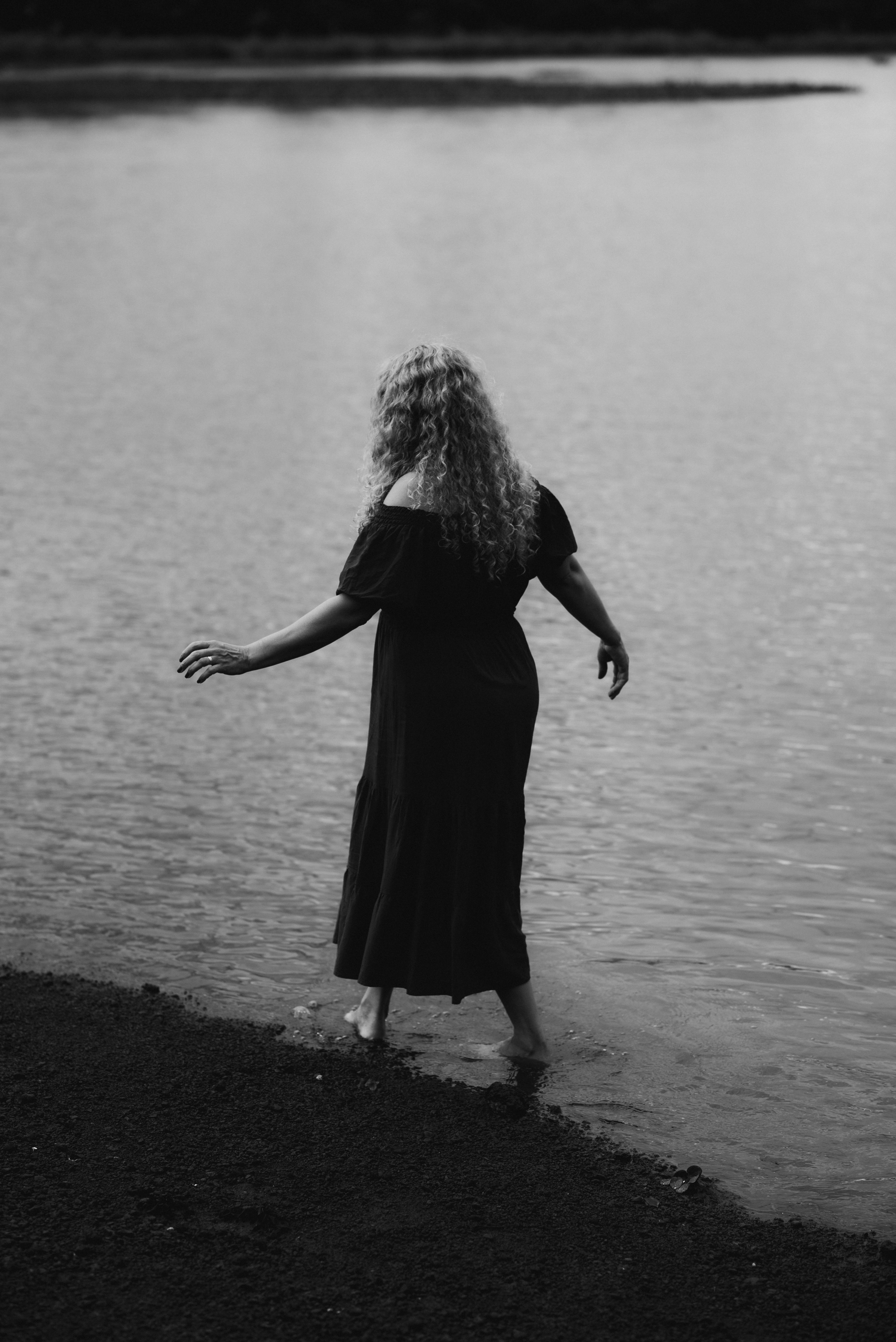 Photo of a Woman Walking in Water · Free Stock Photo