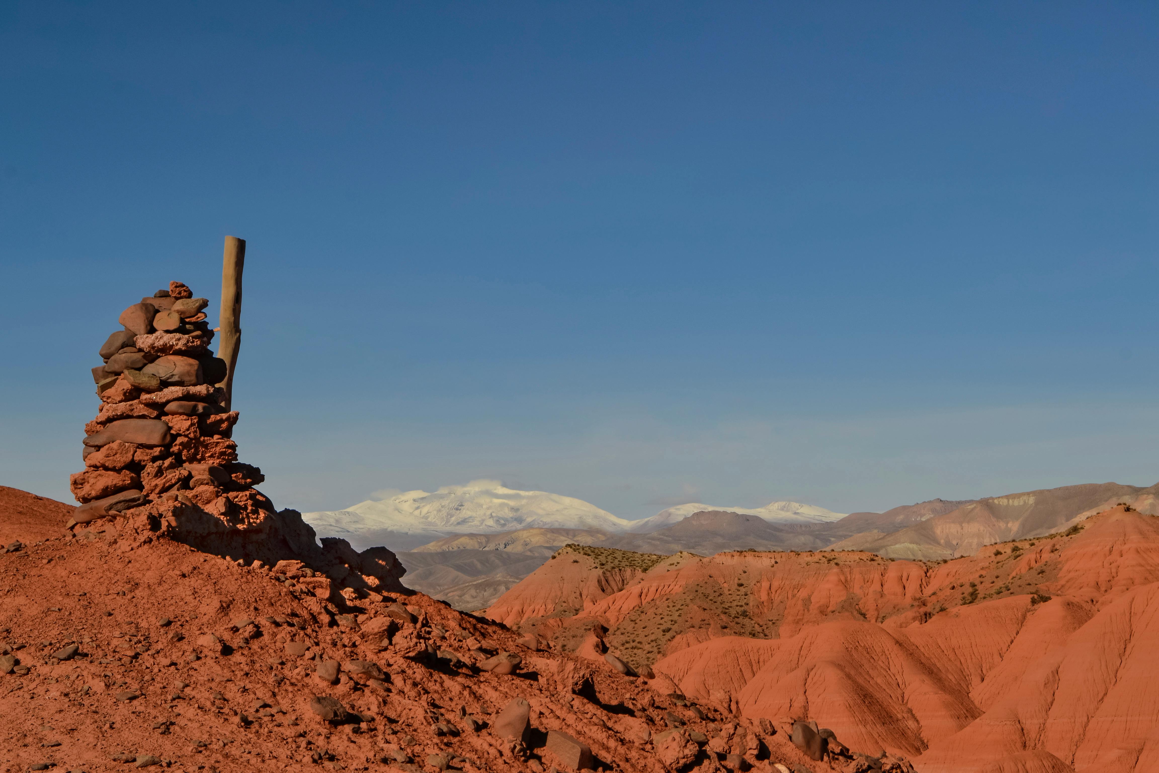 Lights on Clear, Night Sky over Barren Rock Formations · Free Stock Photo