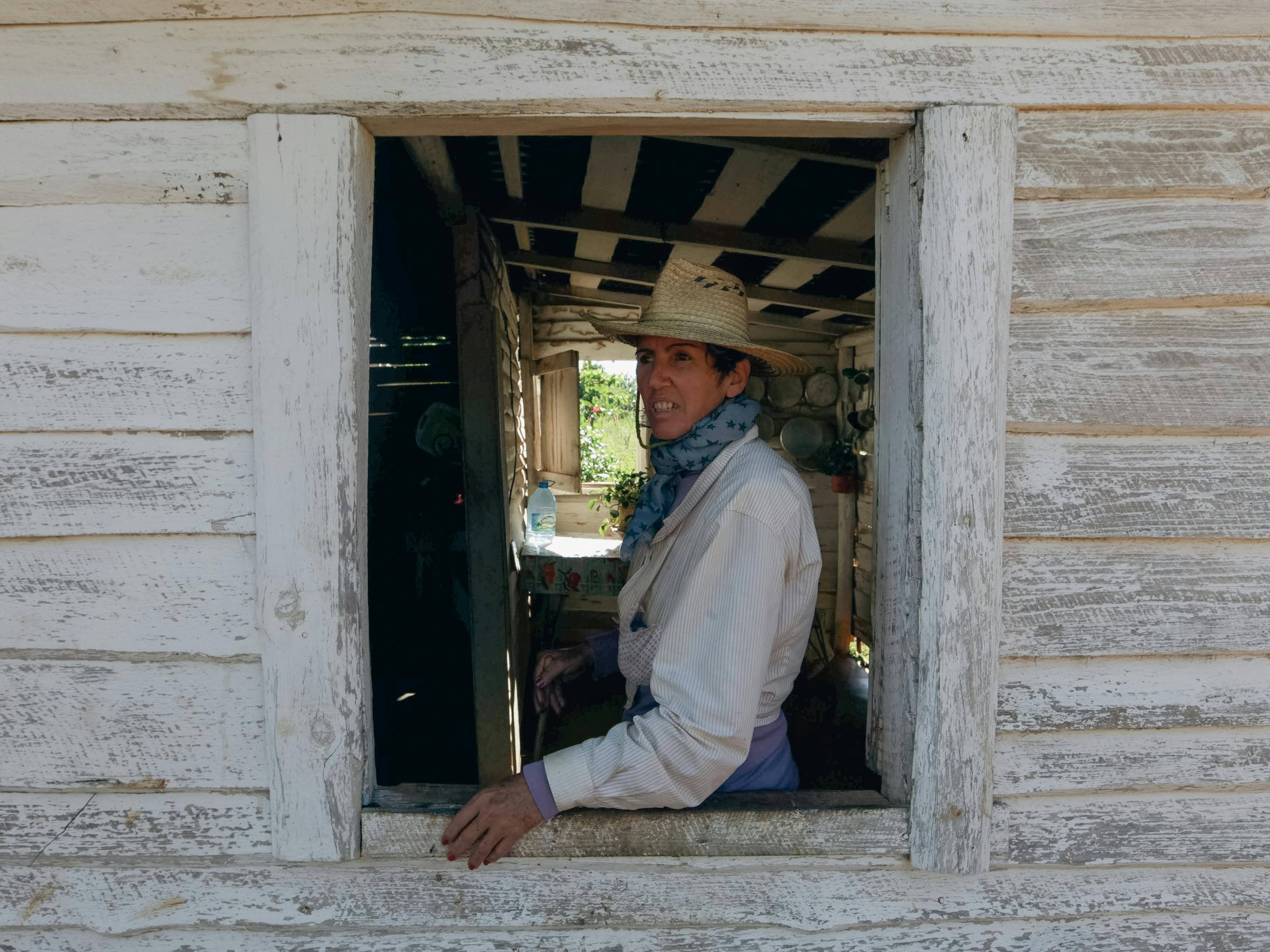 Cowboy Posing in Window Opening · Free Stock Photo