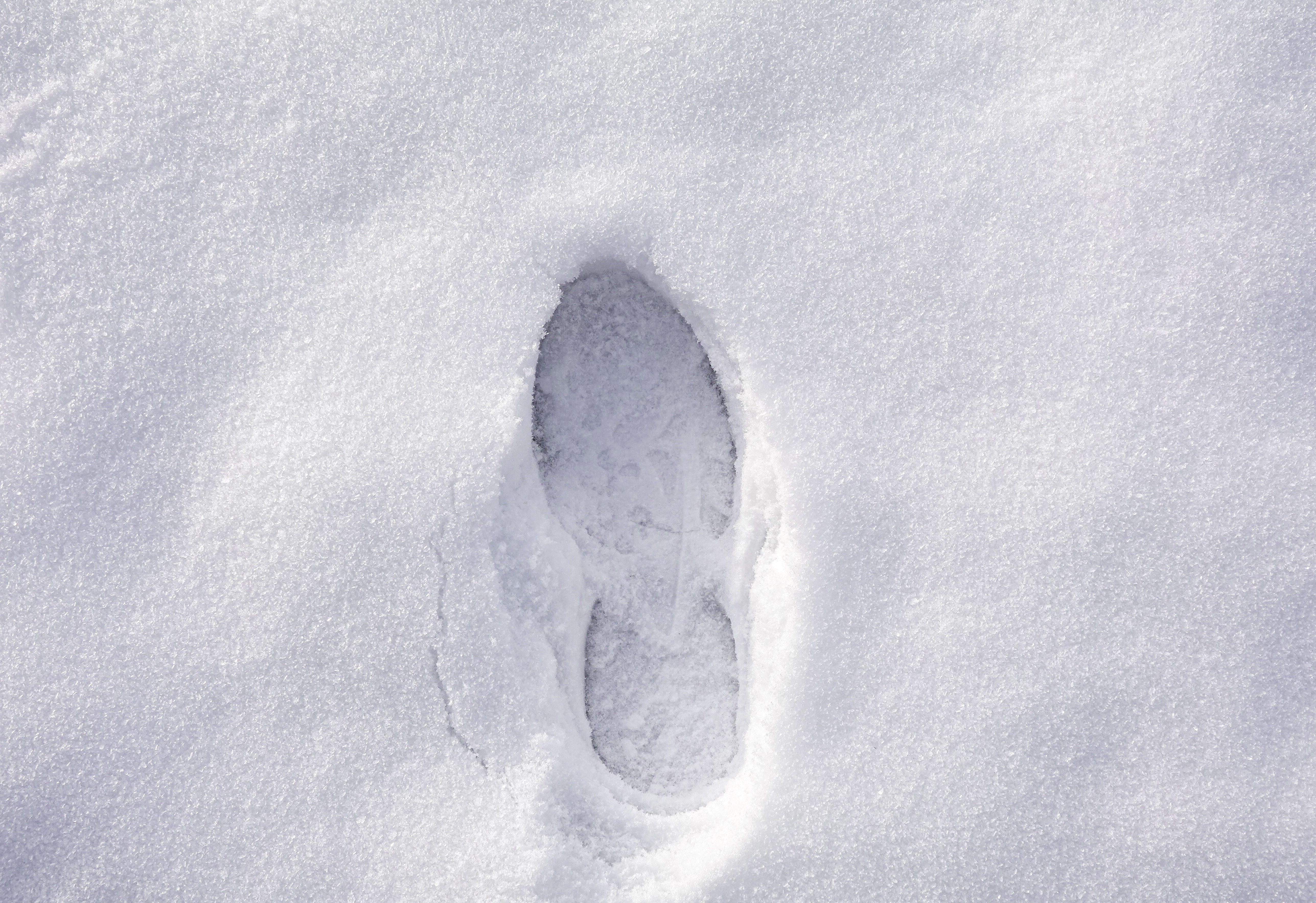 Photograph of a Footprint on Snow · Free Stock Photo