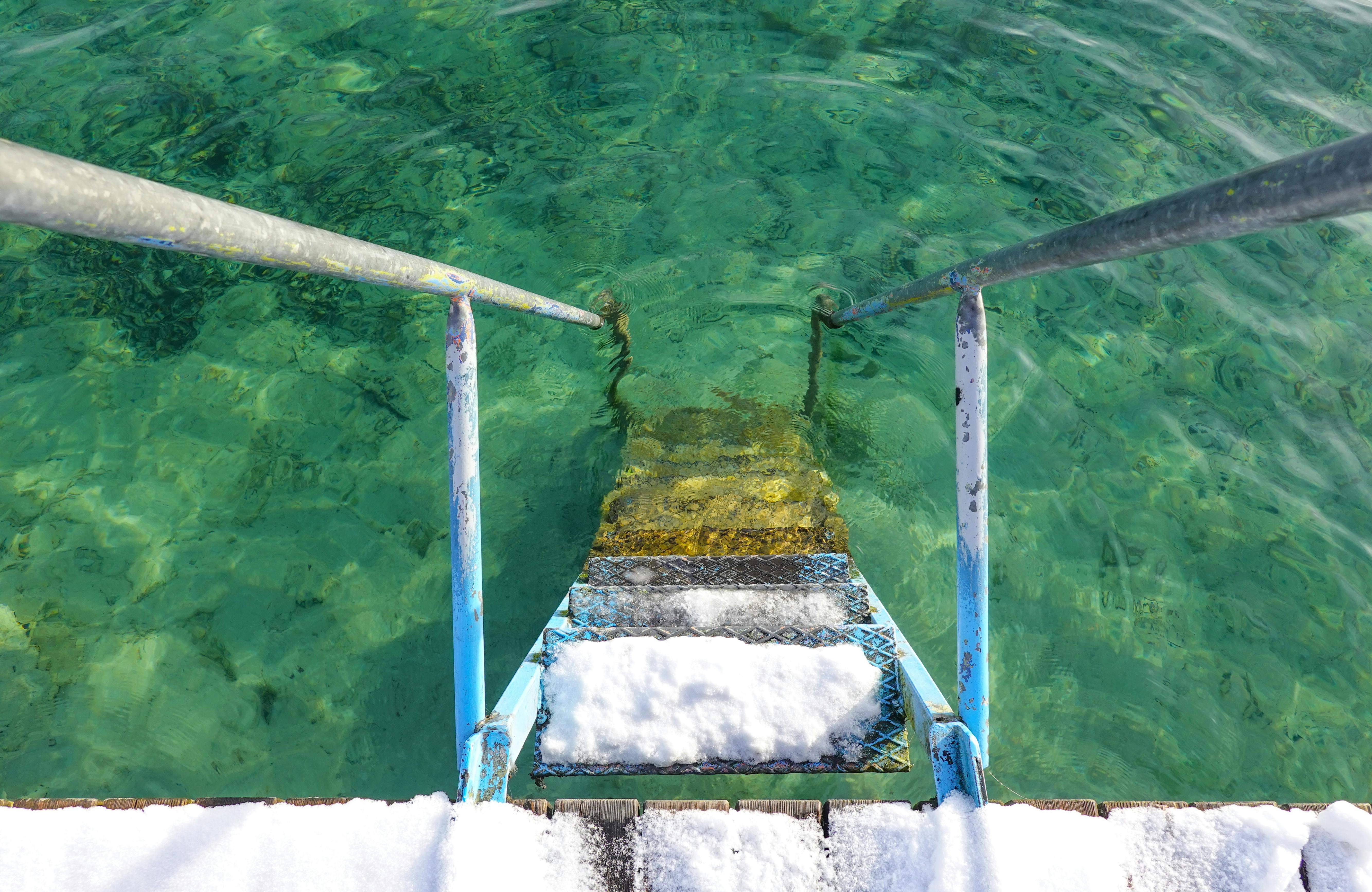 Steel Ladder on Body of Water · Free Stock Photo
