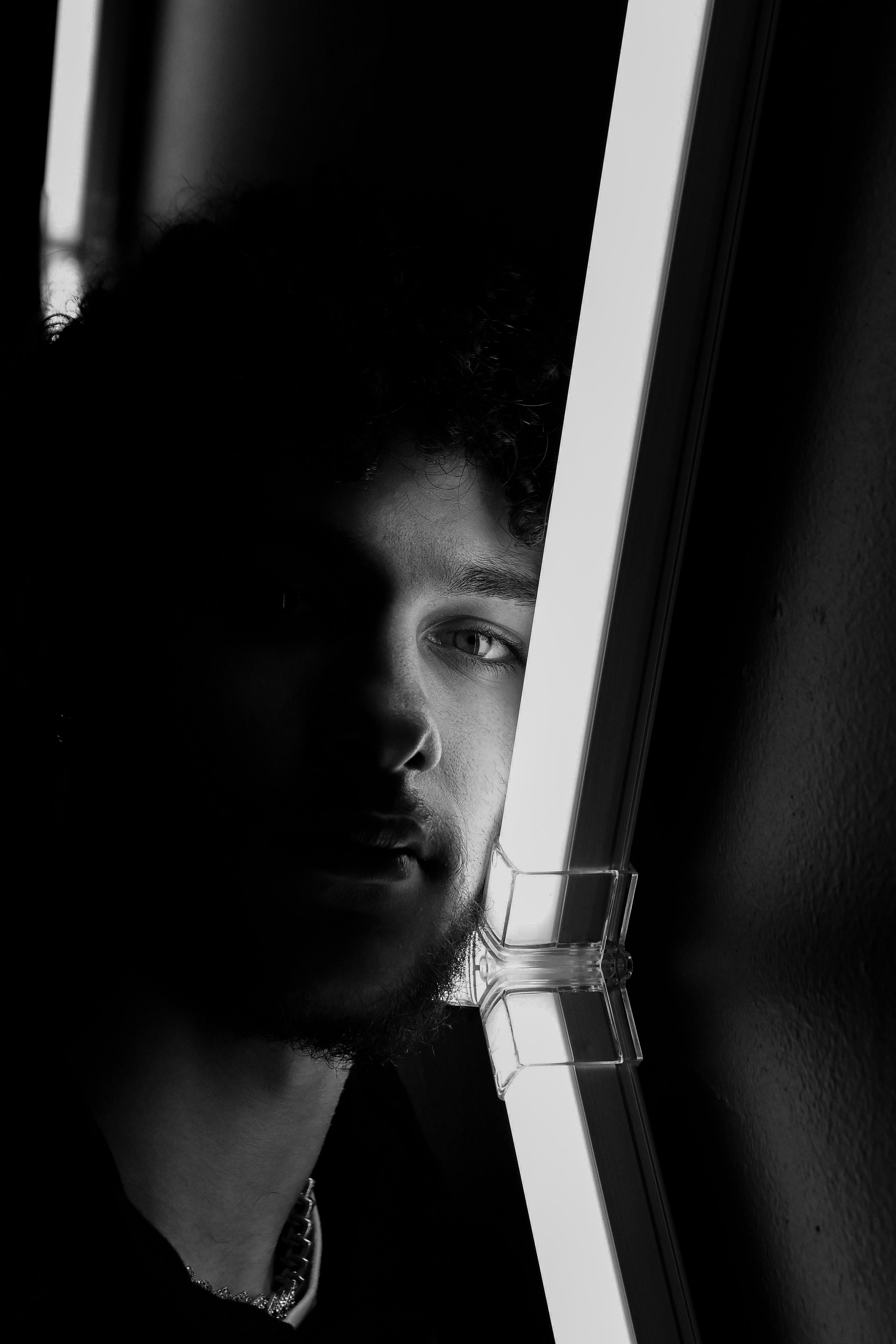 Man Face near Light in Darkness · Free Stock Photo